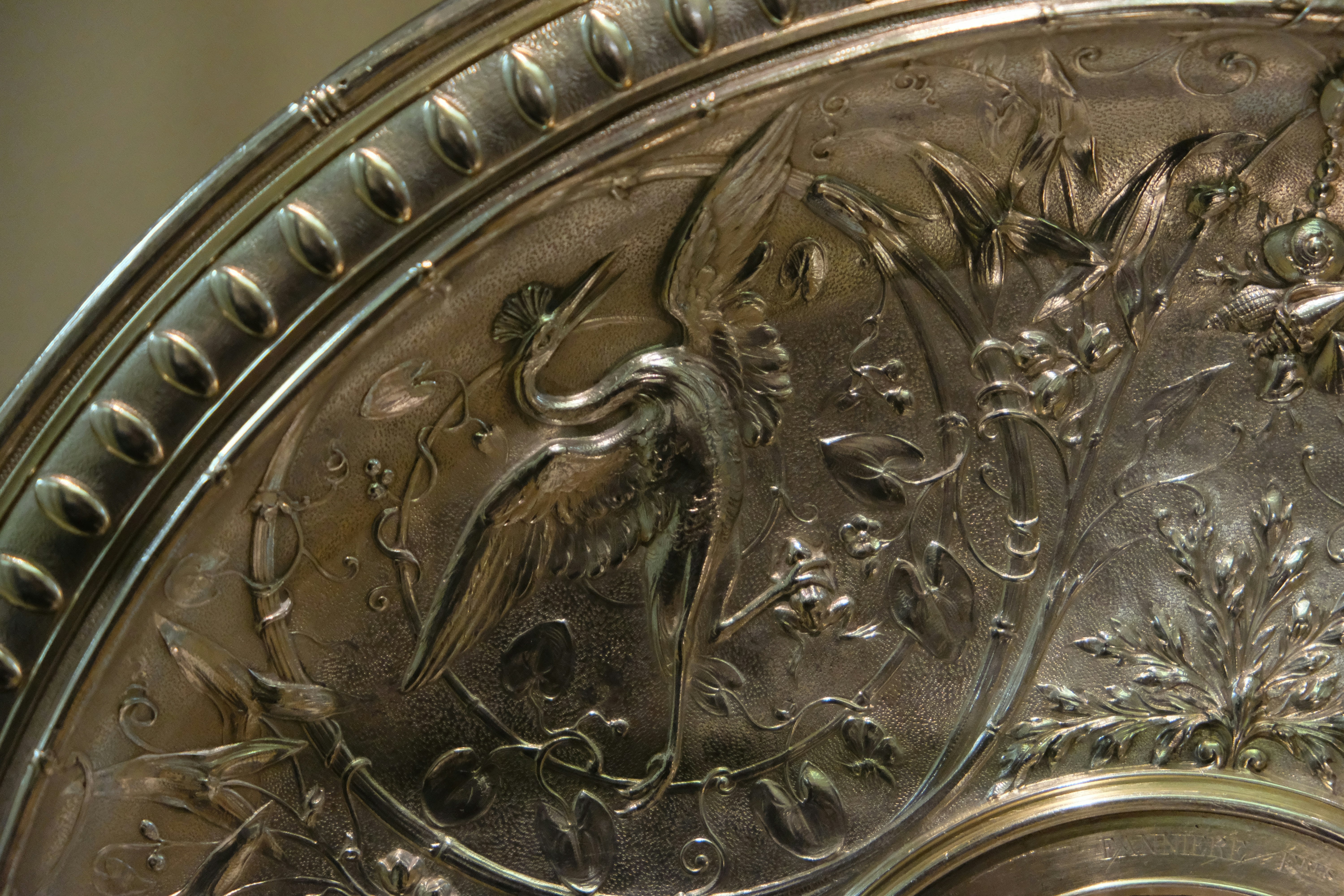 Heritage Keepsake: A Silver Plate's Ornate Carving in Focus