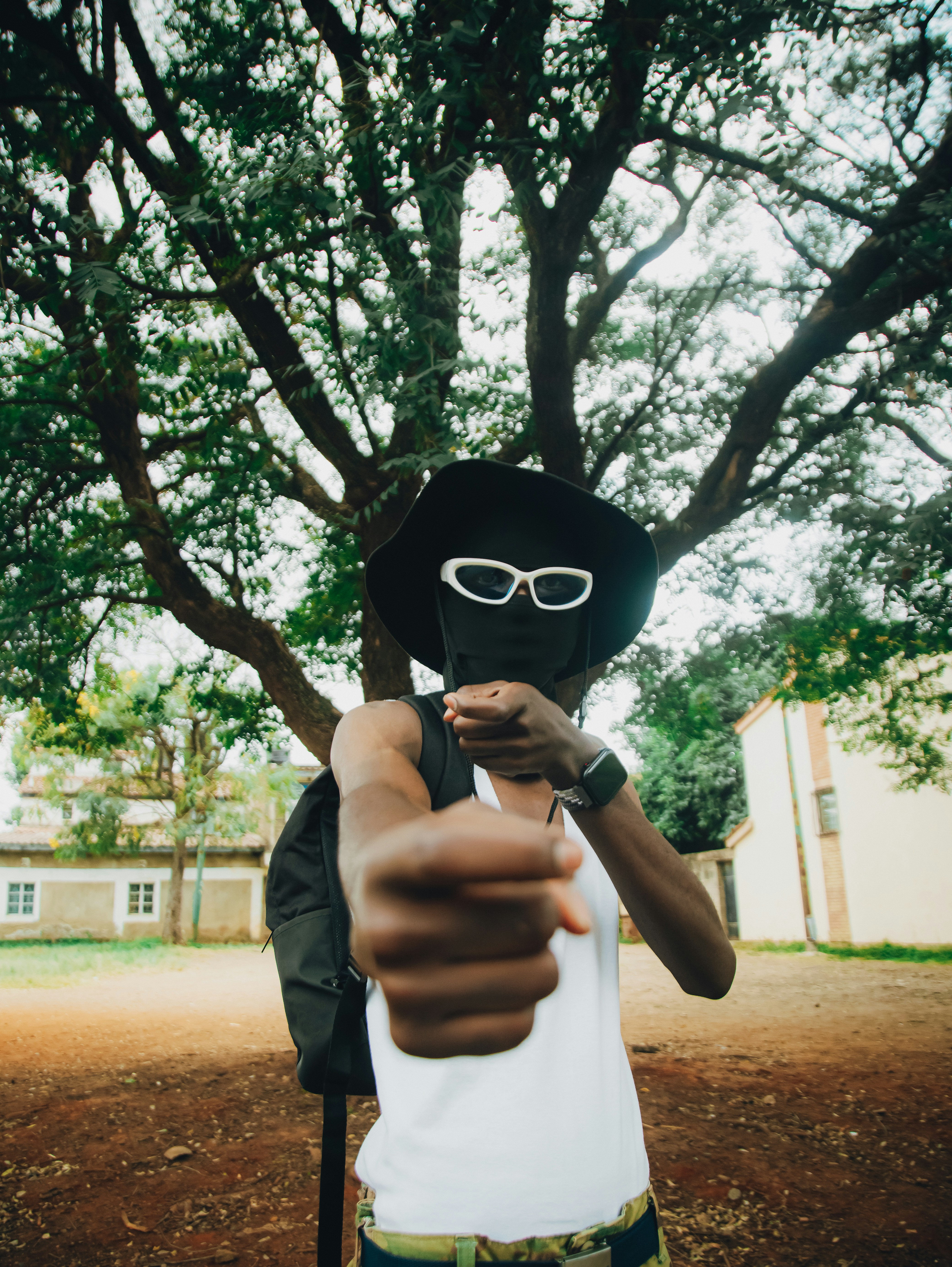 Masked Street Mojo: A Bold Pose Under the Canopy