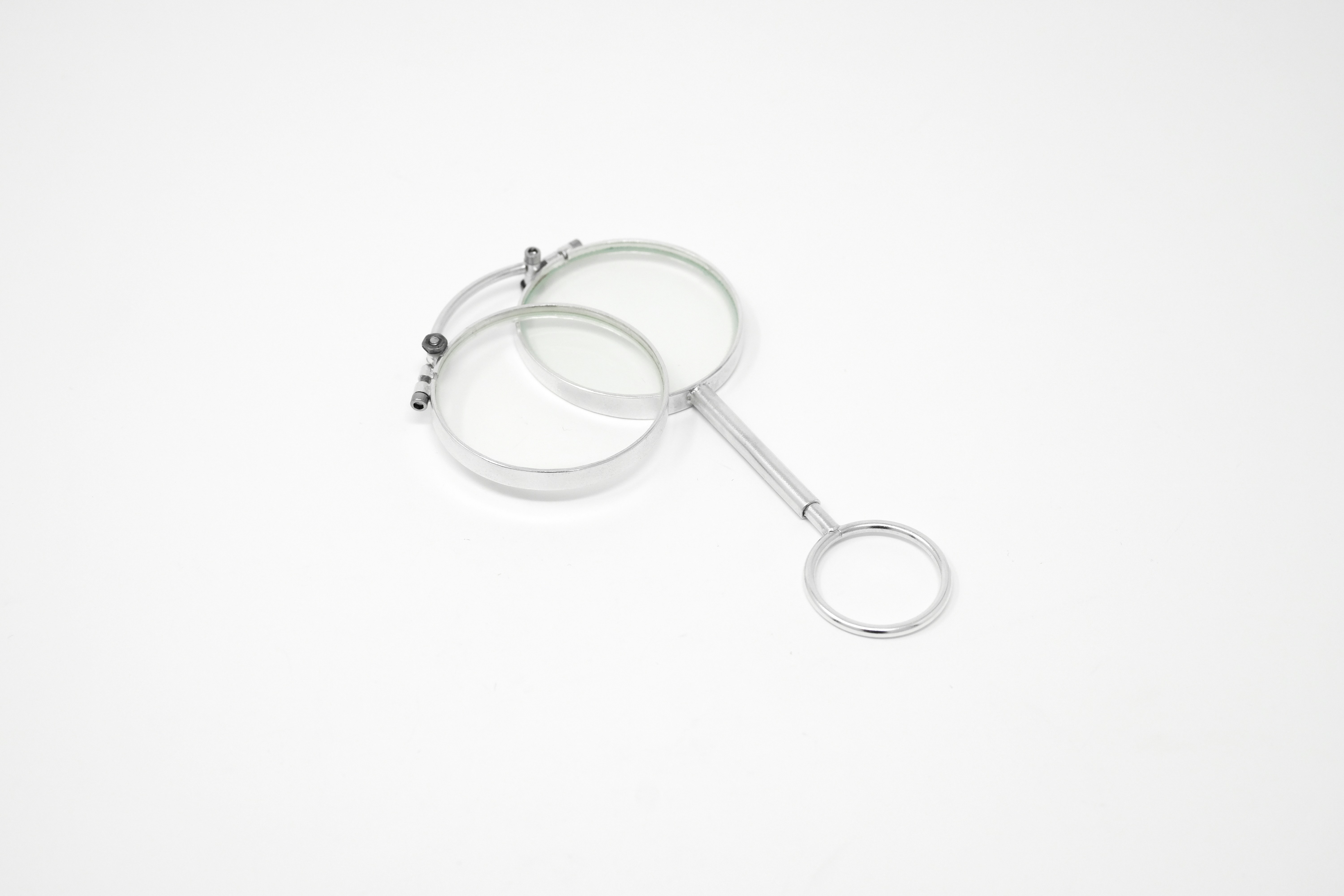 Chromed Keyring Magnified: A Minimalist Study of Curves