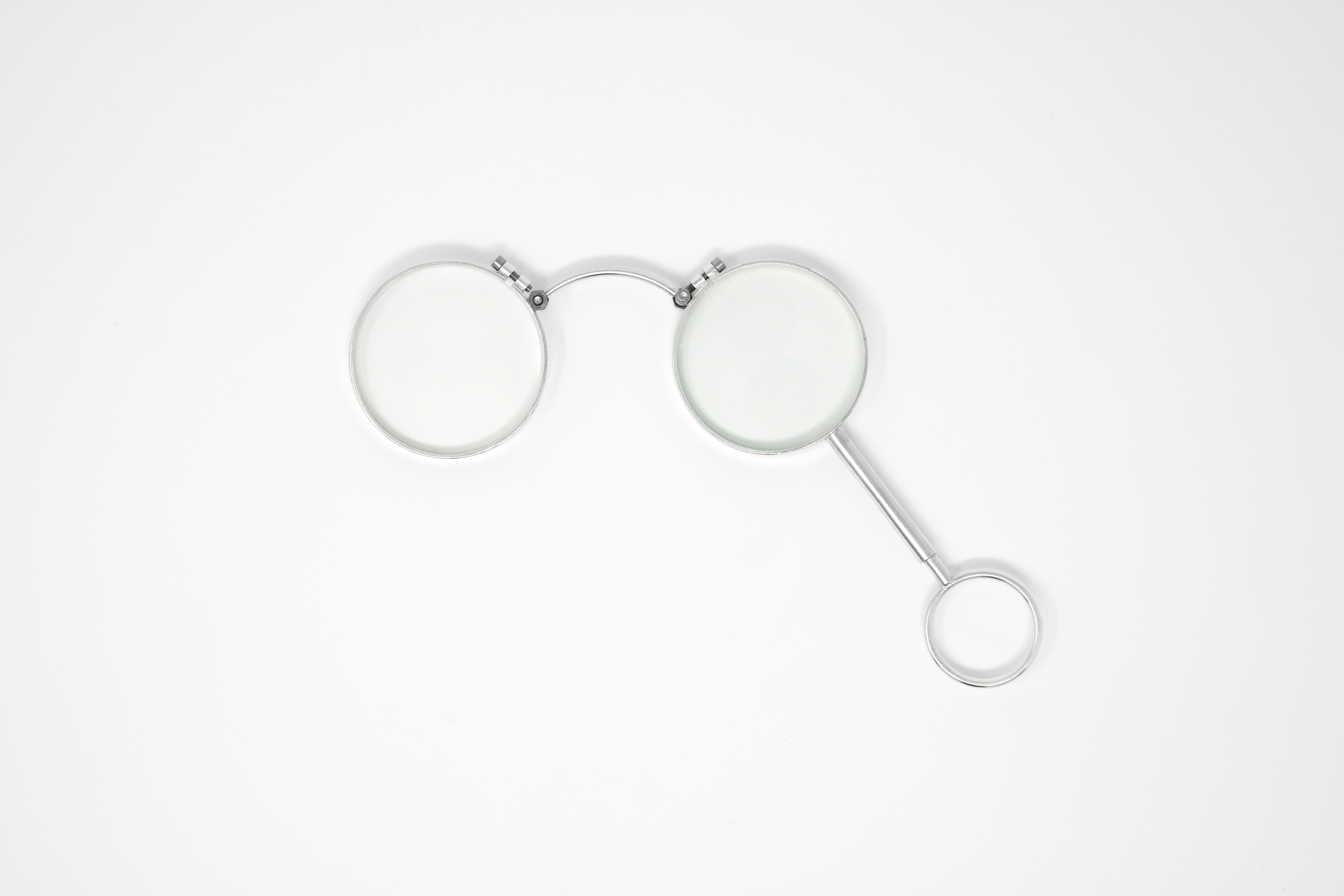 Twin Lenses of Clarity: A Minimalist Magnifier on White