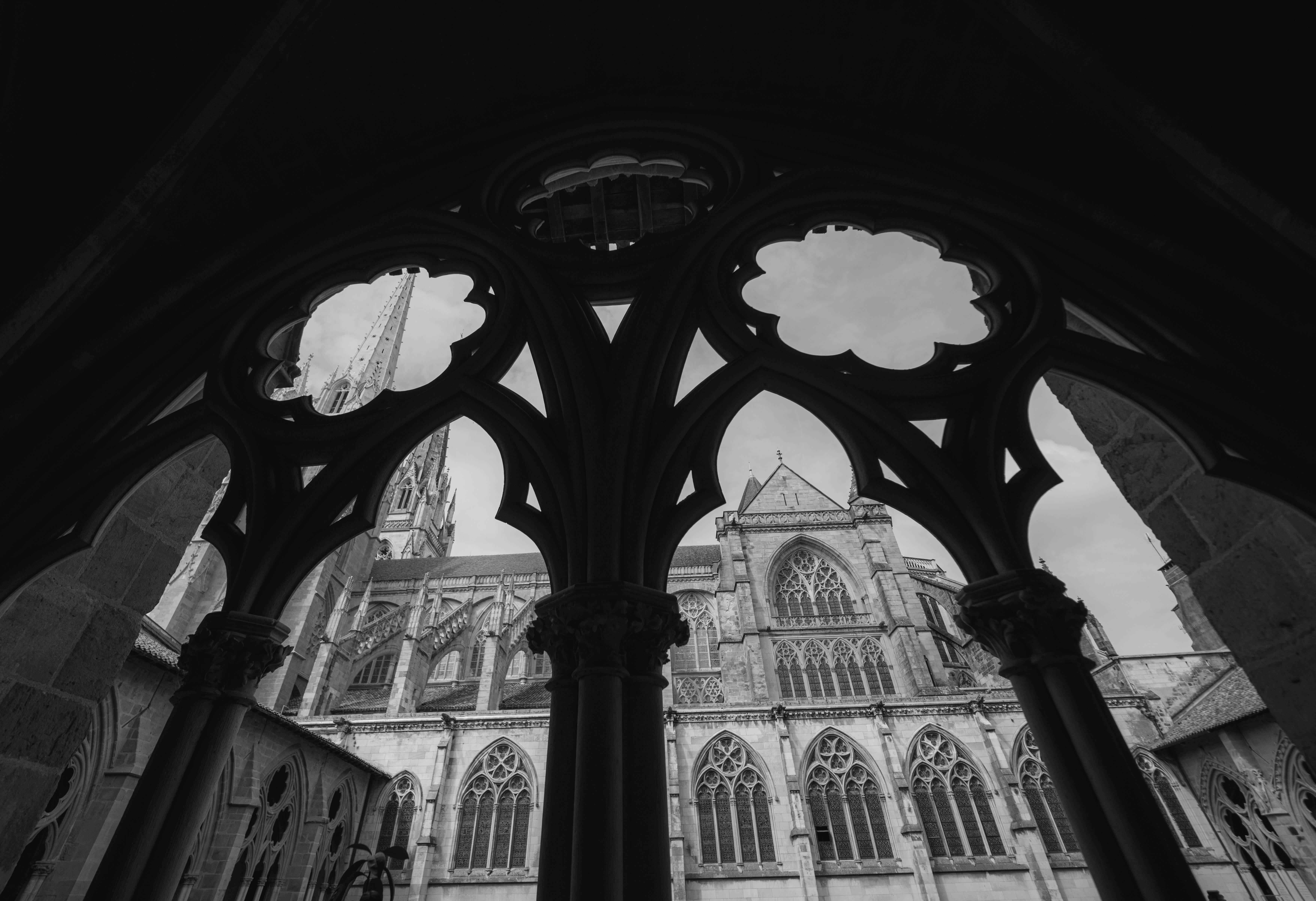 Gothic Arches: Framed Cathedral Through Carved Pillars