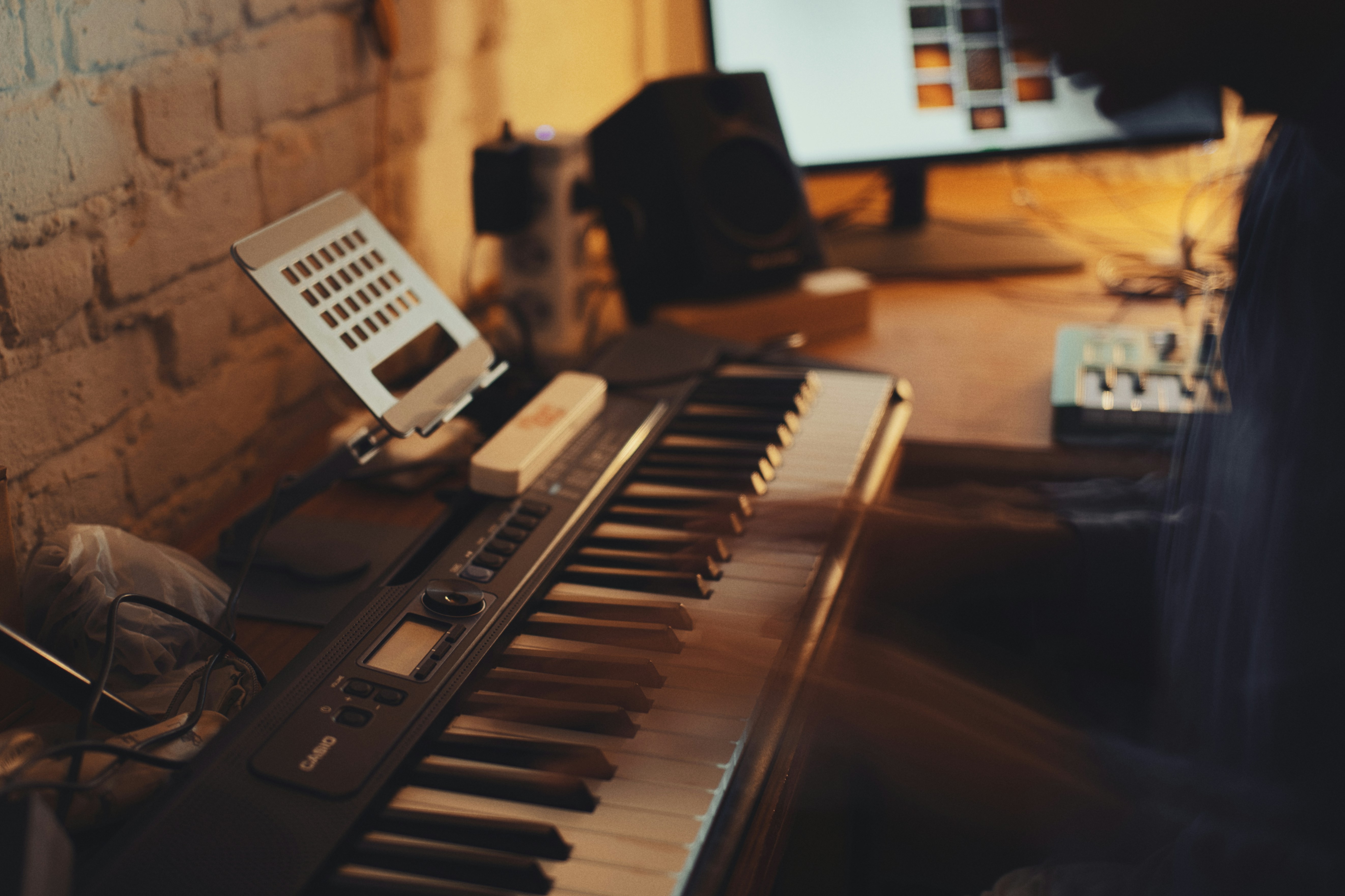 Softly Lit Keys: A Creator's Studio at Dusk