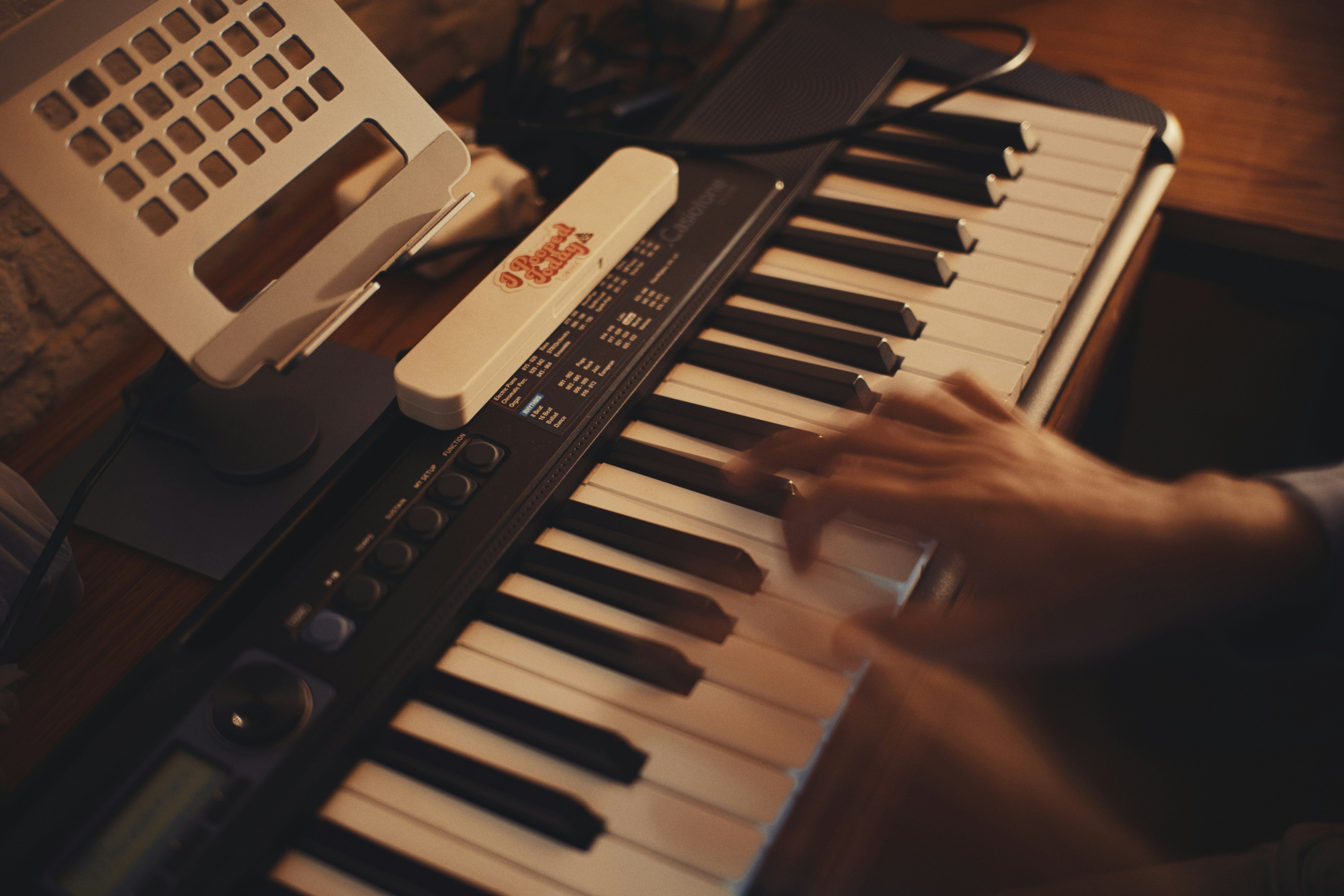 Motion in Keys: Hands Blur Across a Compact Mini Keyboard
