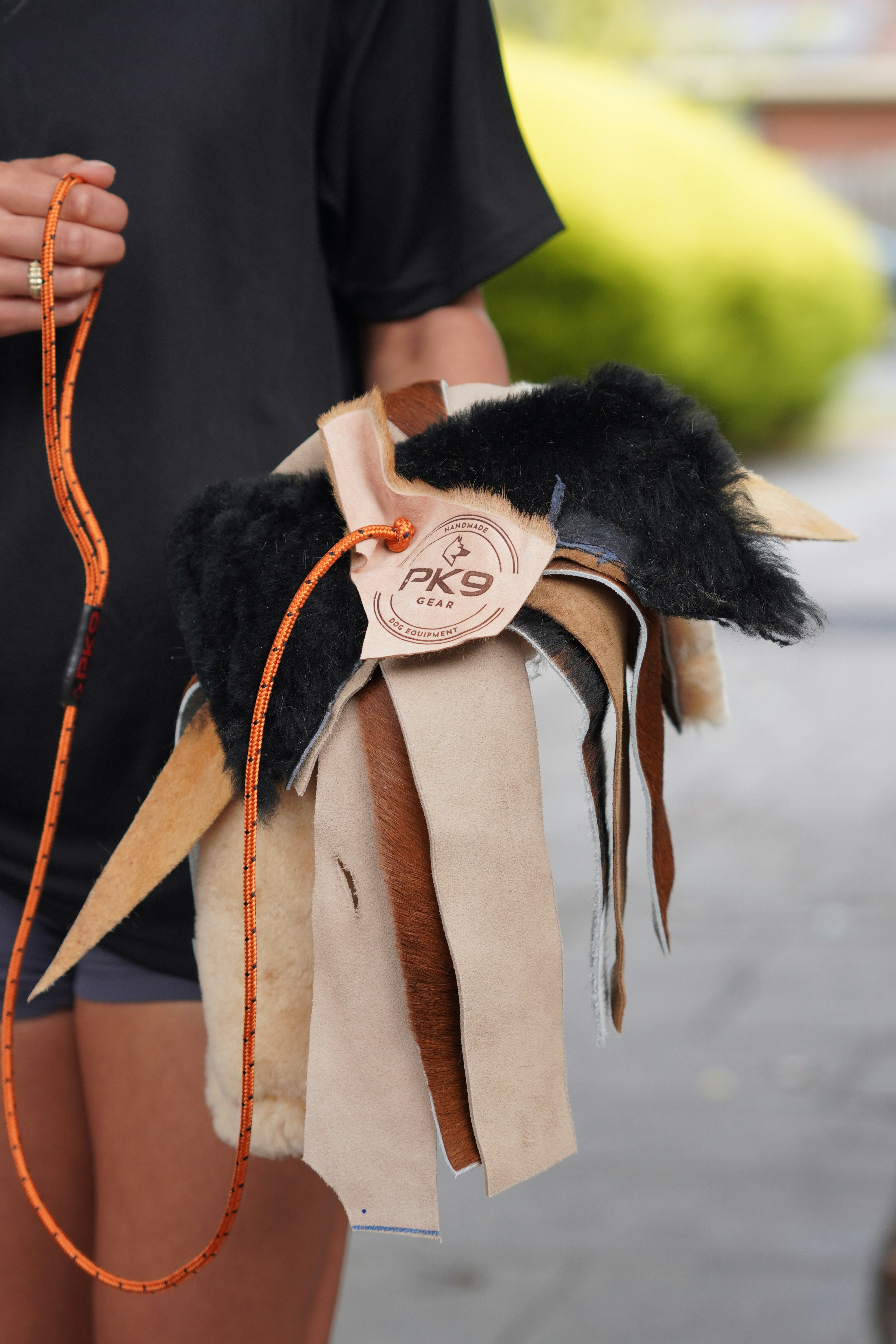 Strips of Leather and Velour: A Close-Up of Crafting in Hand
