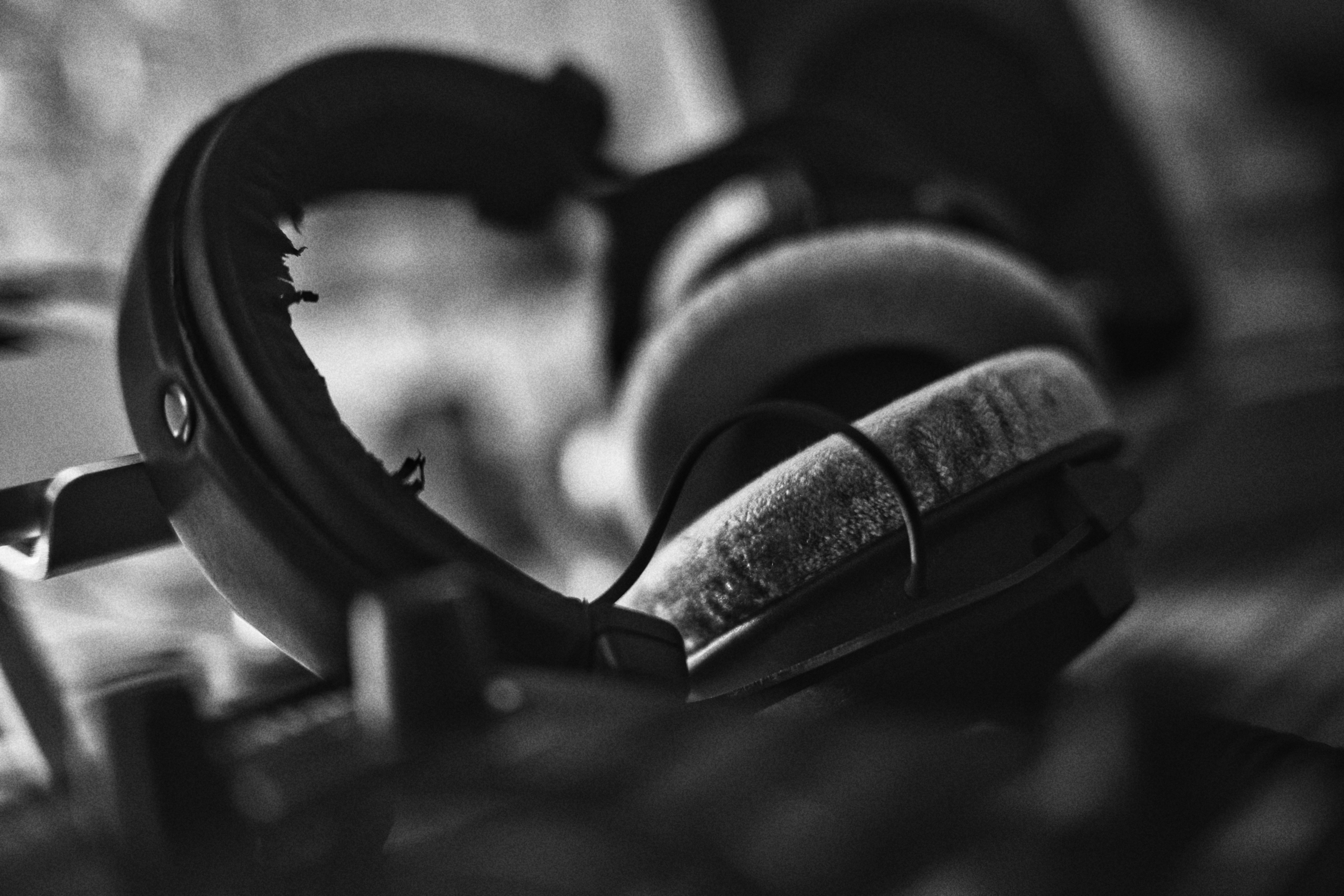 Aged headphones in monochrome: texture and grain on the verge of memory