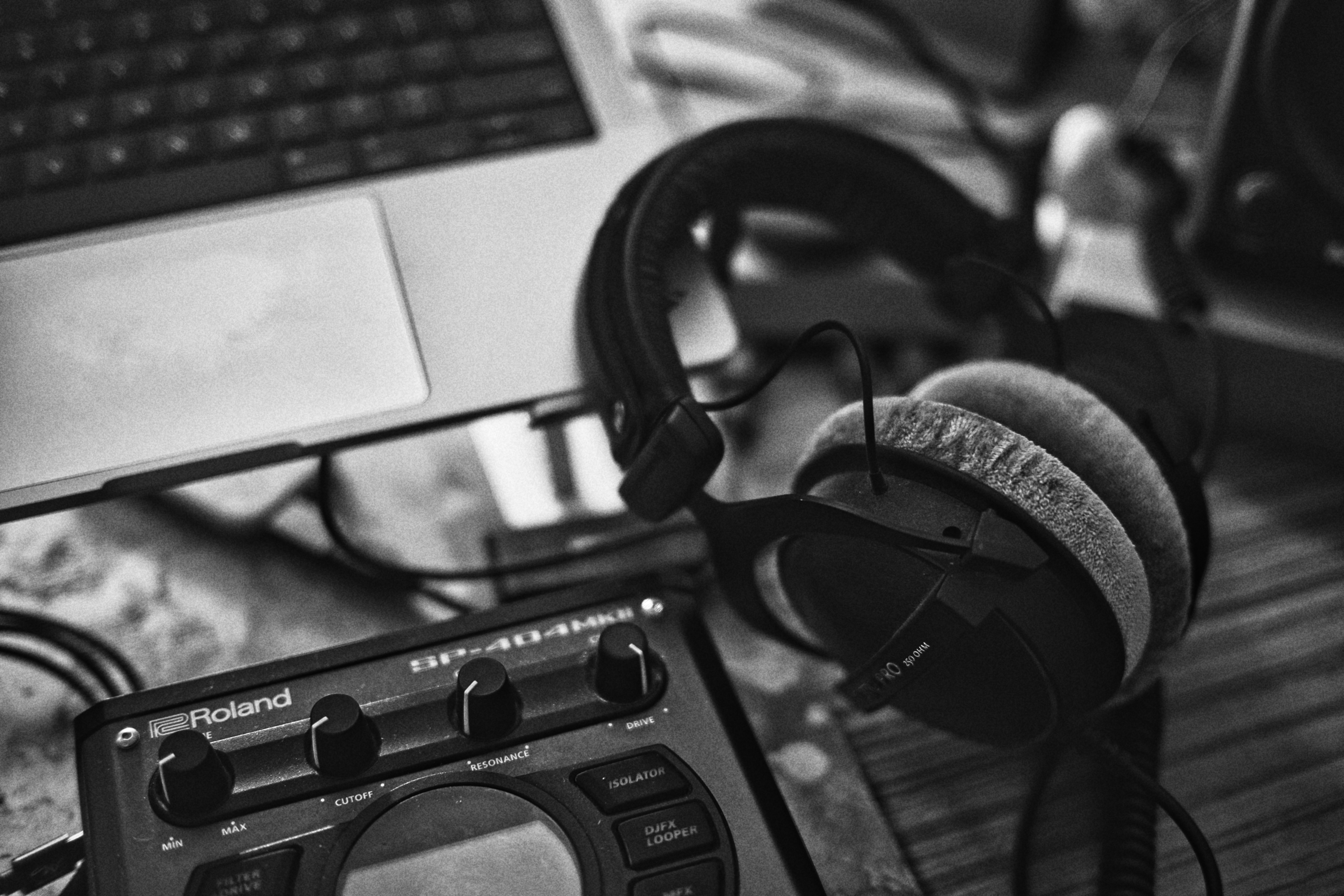 Analog Pulse: Headphones Rest Above a Rolling Studio Scene