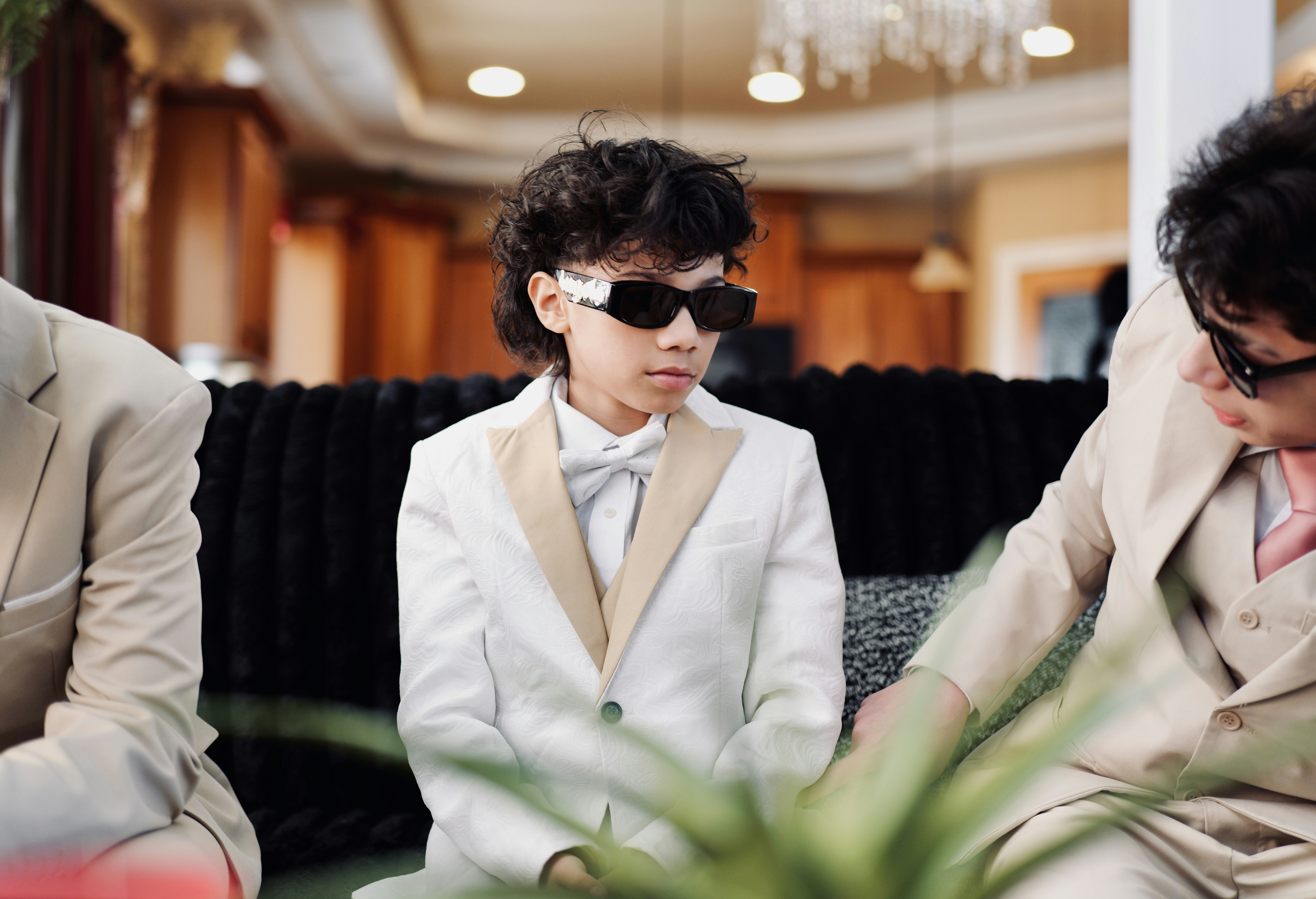 Sharp-eyed Groom in White: A Formal Conversation in Soft Focus