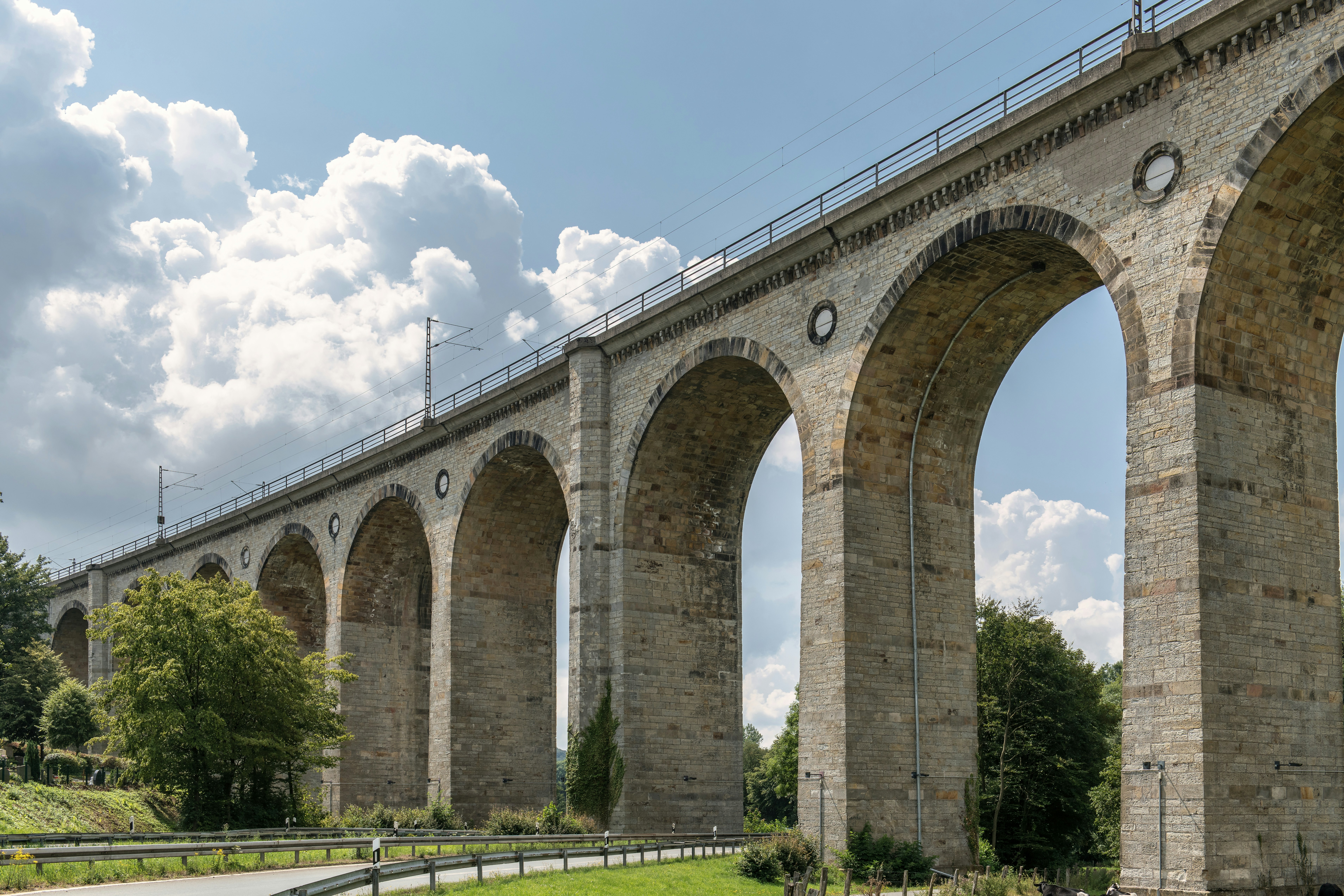 Stone Arc Symphony: A Sunlit Viaduct Reaching Toward the Sky