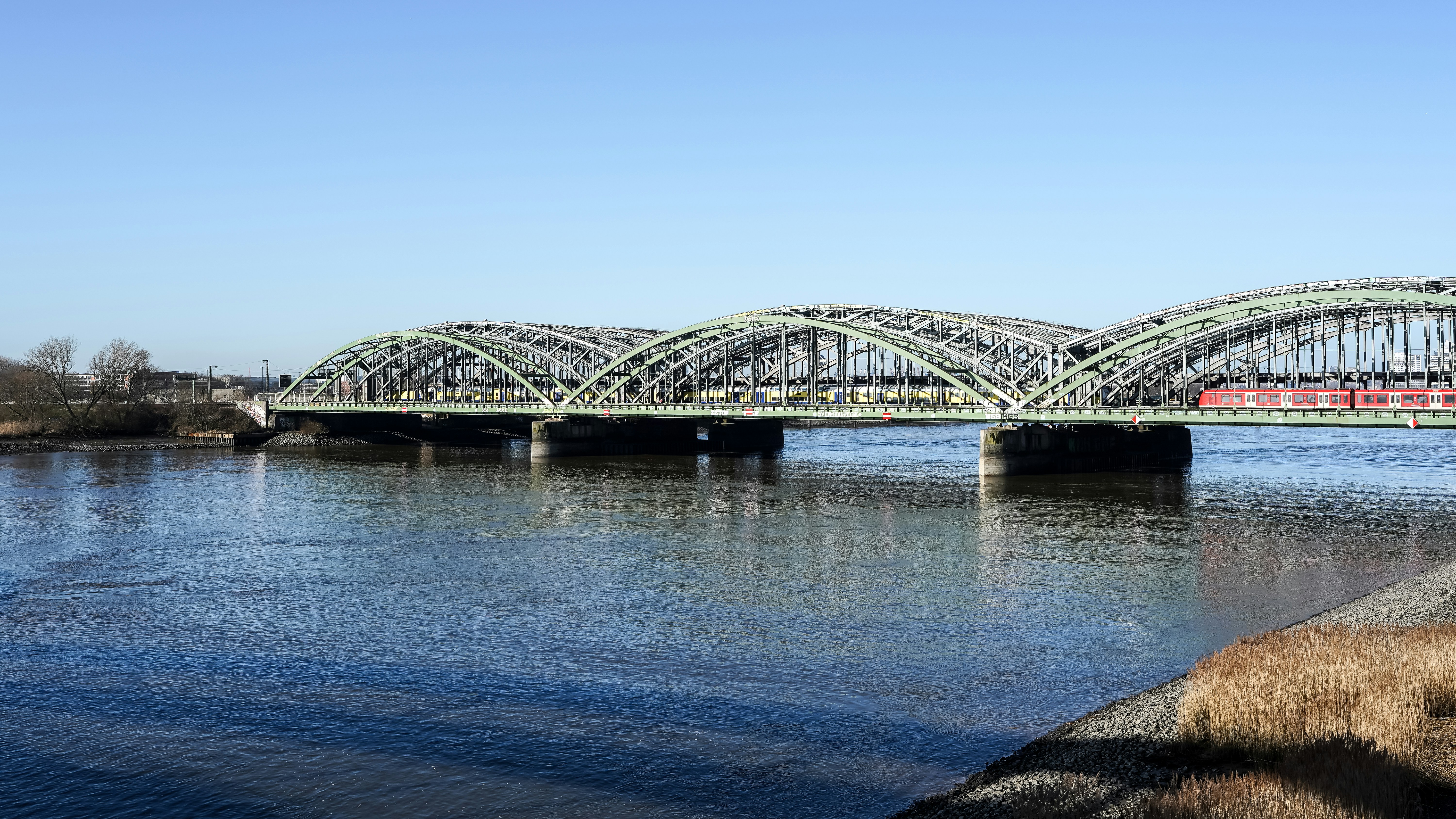 Steel Arches Over the Quiet River