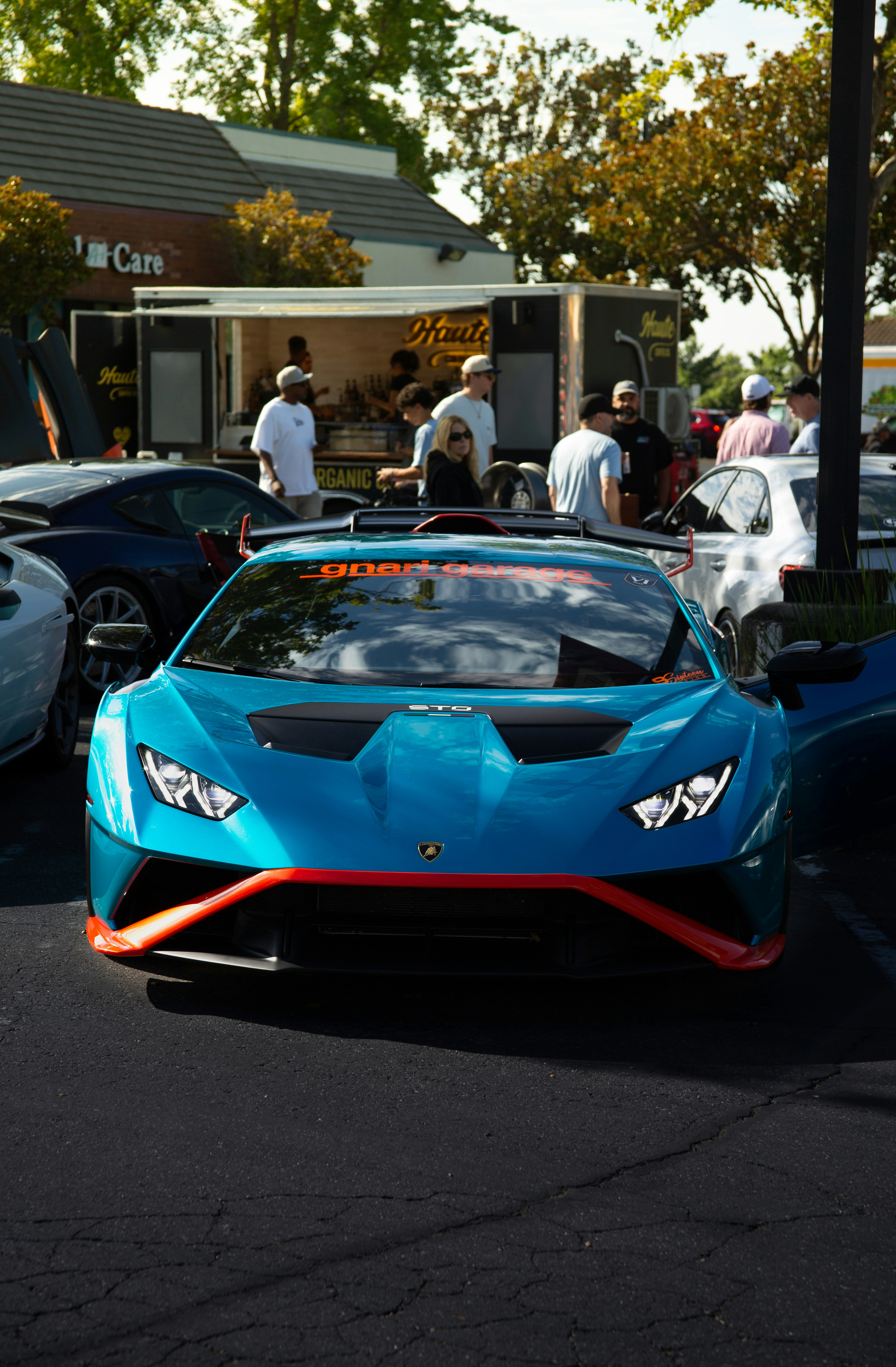 Blue Lamborghini Huracán at a Car Show: The Peak of the Crowd