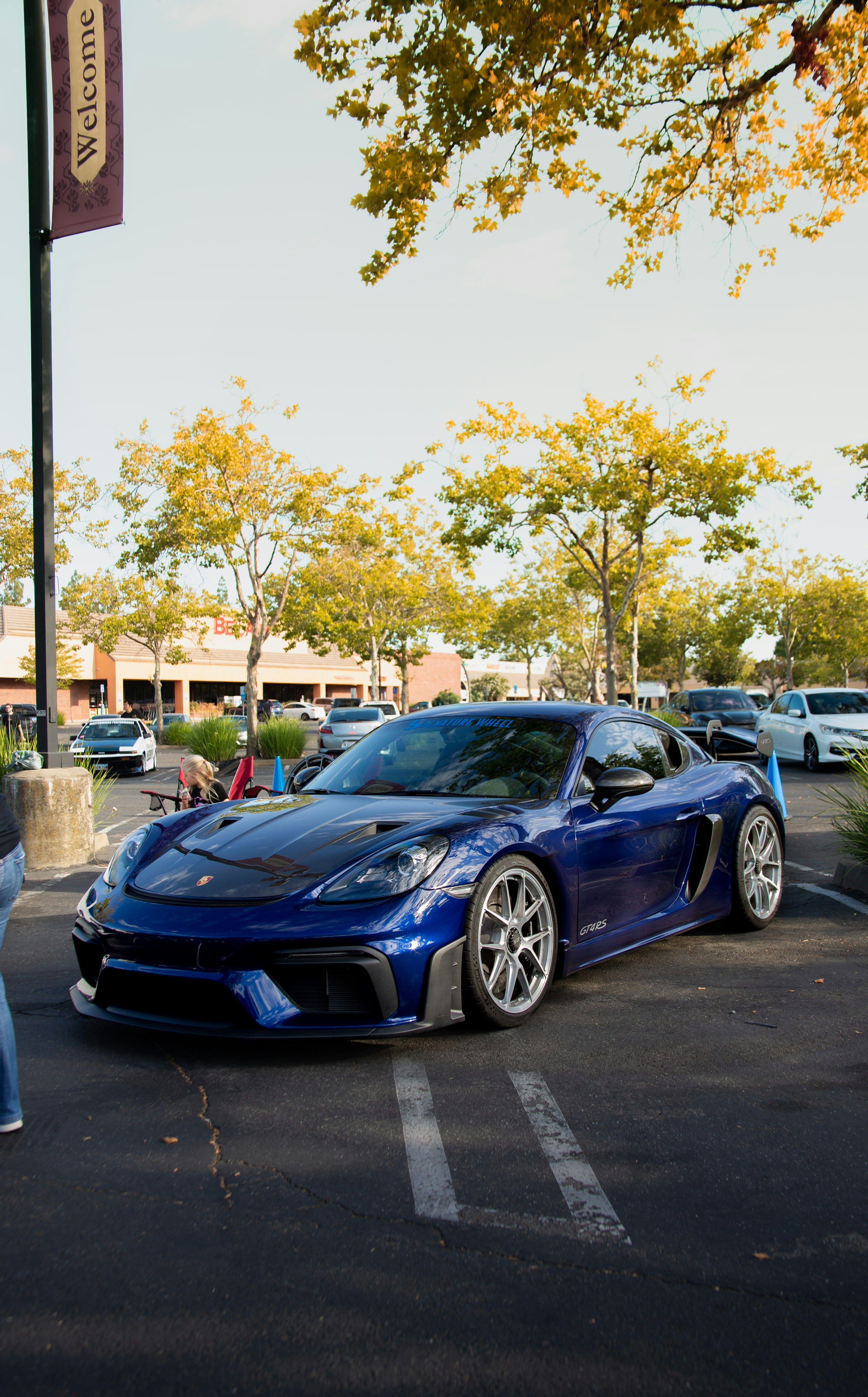 Blue Porsche in a Sunlit Lot: Curves, Chromes, and Autumn Light