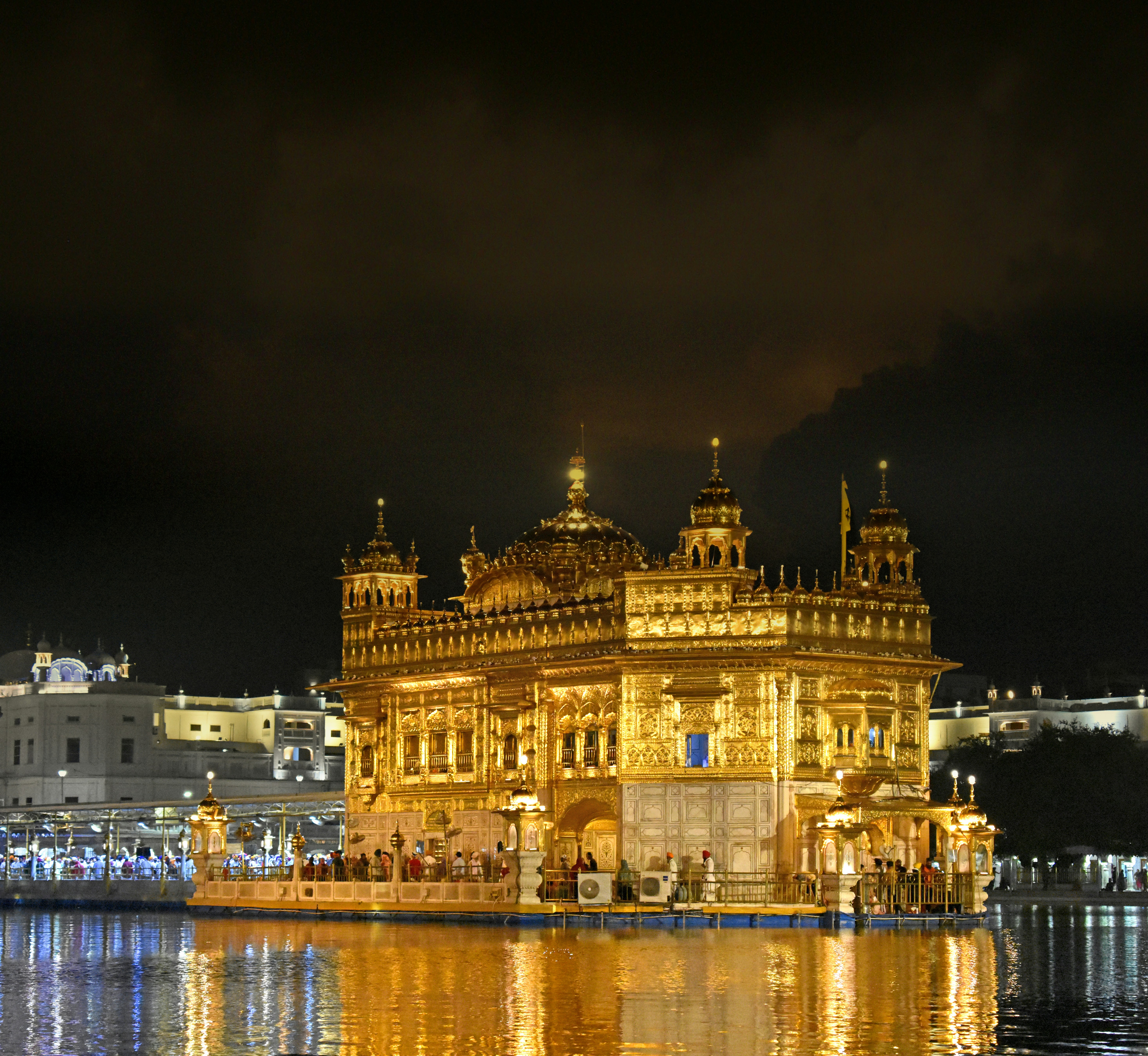 Golden Shrine at Night: Reflections Across the Sacred Pool