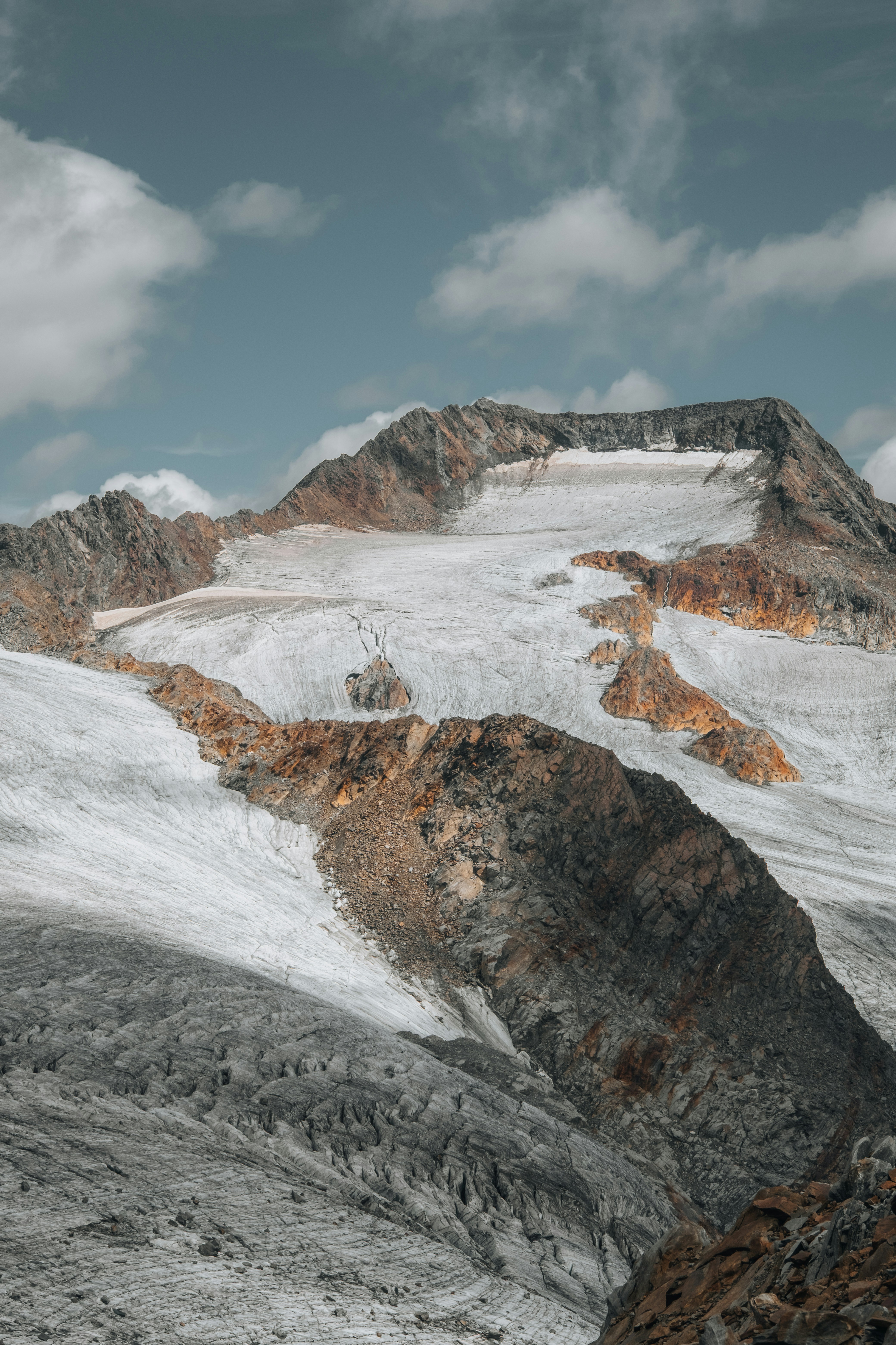 Rugged Snow-Scarred Ridge Under a Clear Sky