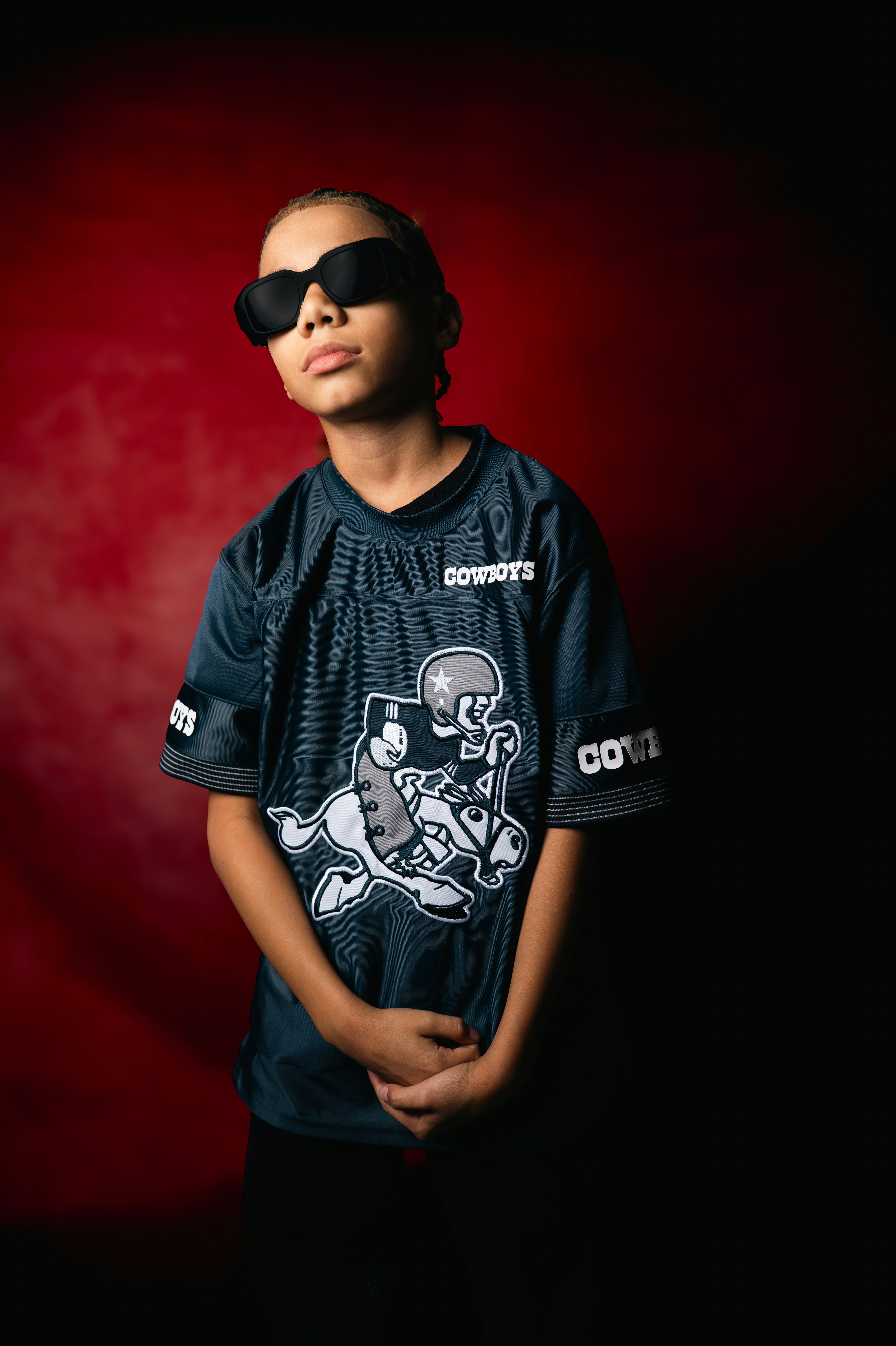 Shaded Vision: A Youthful Runner of Style in Midnight Cowboys Jersey