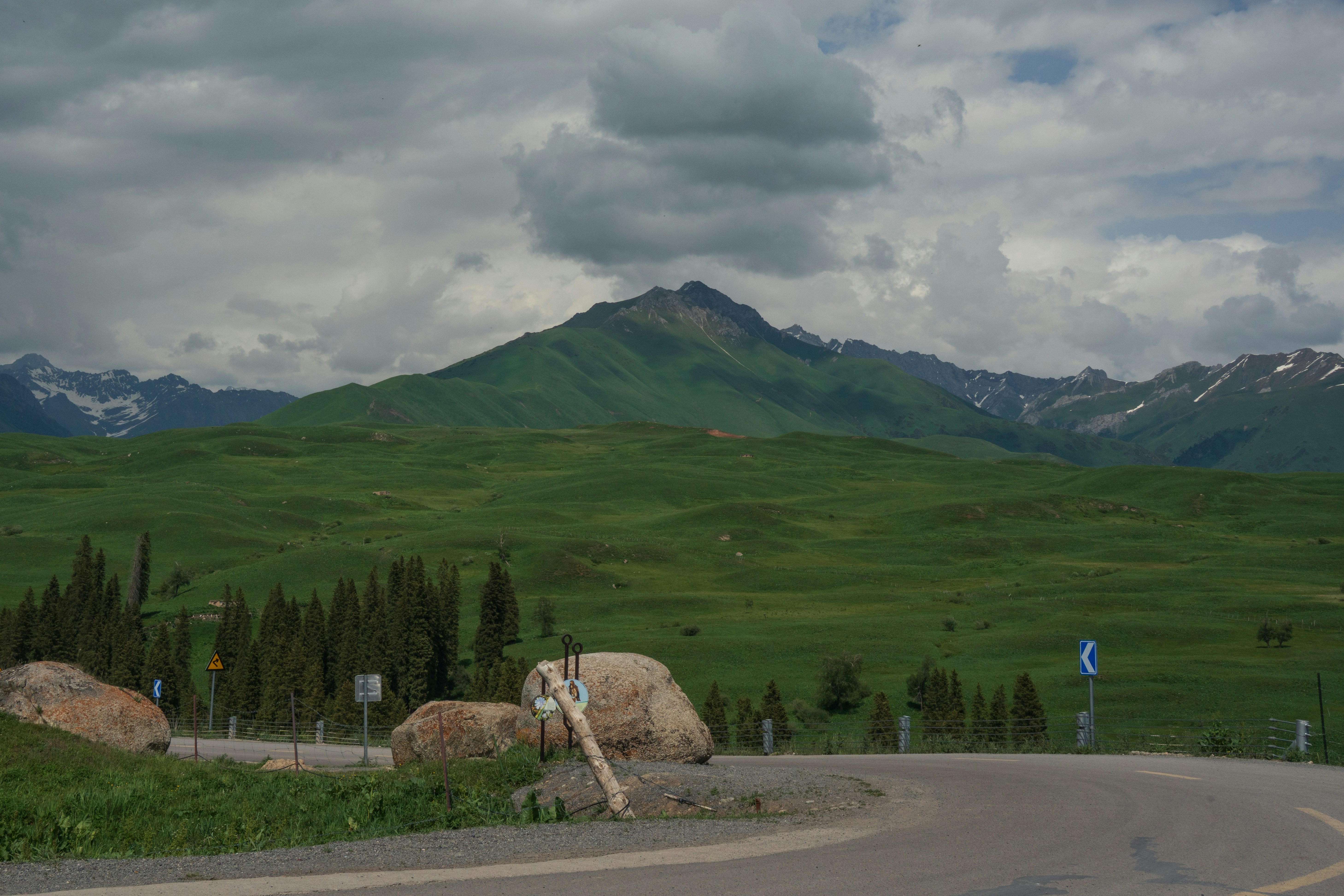 Green Ridge Overlook: Mountain Looms Above a Quiet Curved Road