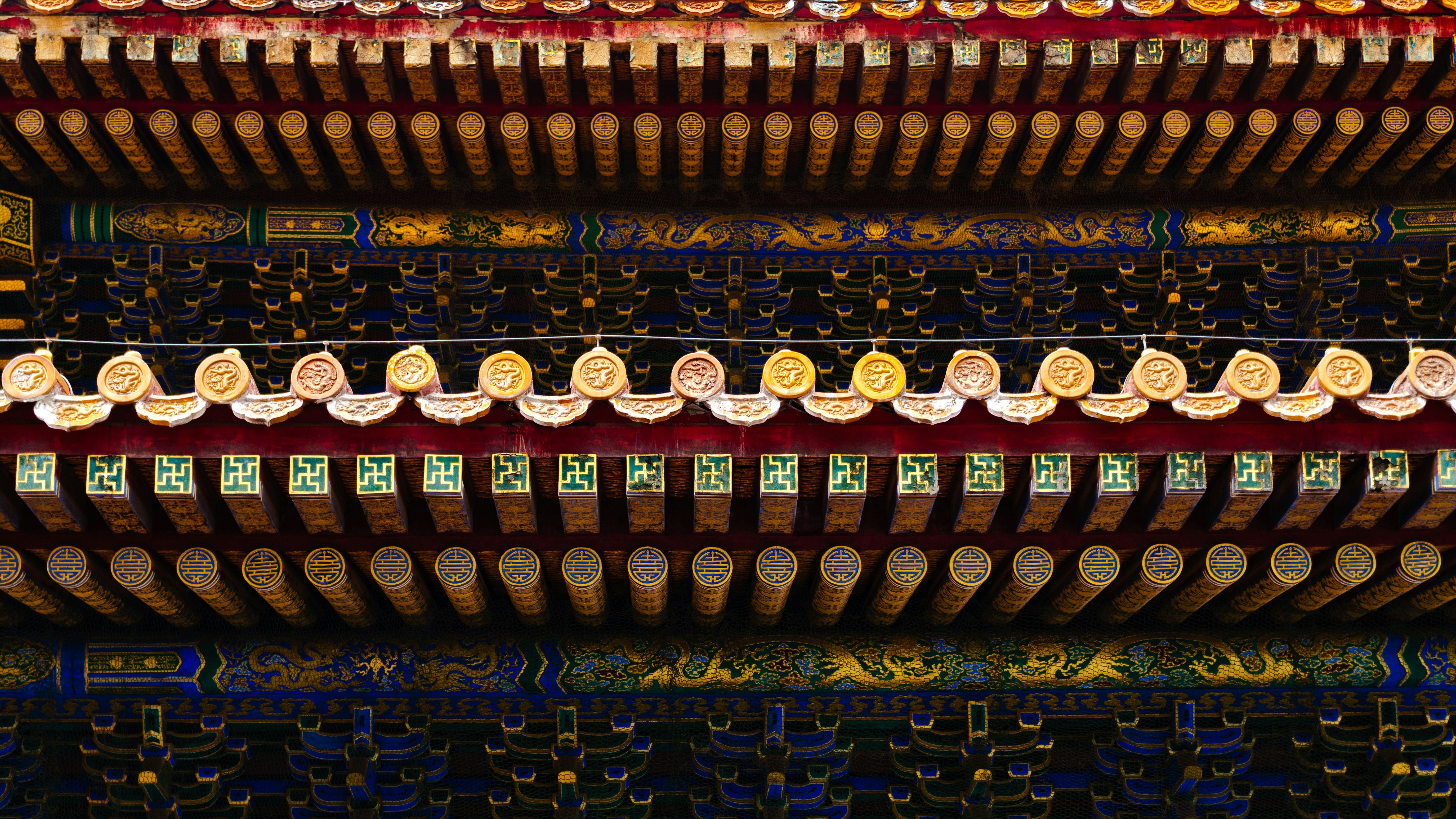 Colorful Megalith of Ridges: A Close-Up of Ornate Tibetan-Style Eaves