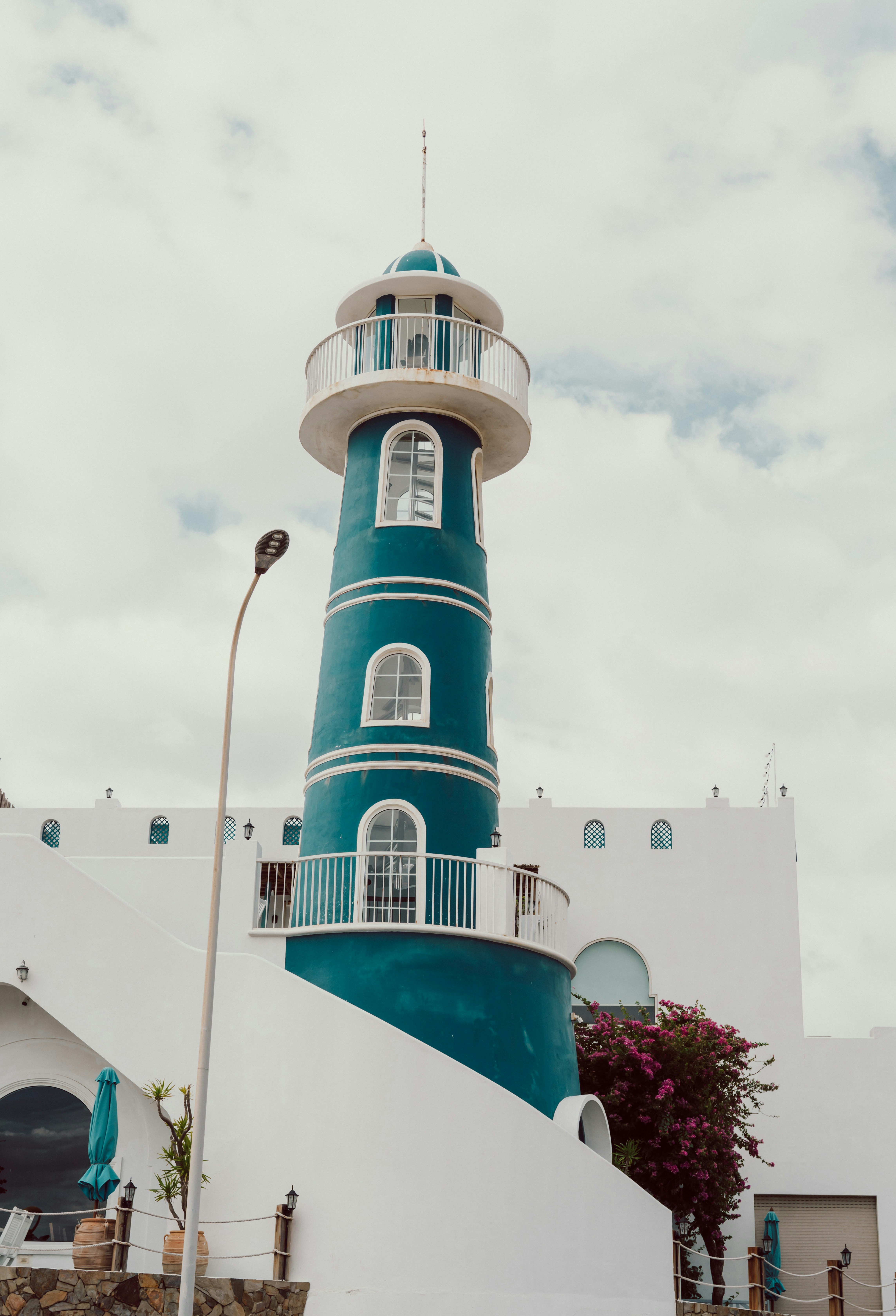 Blue Lighthouse Rises Over White Terrace