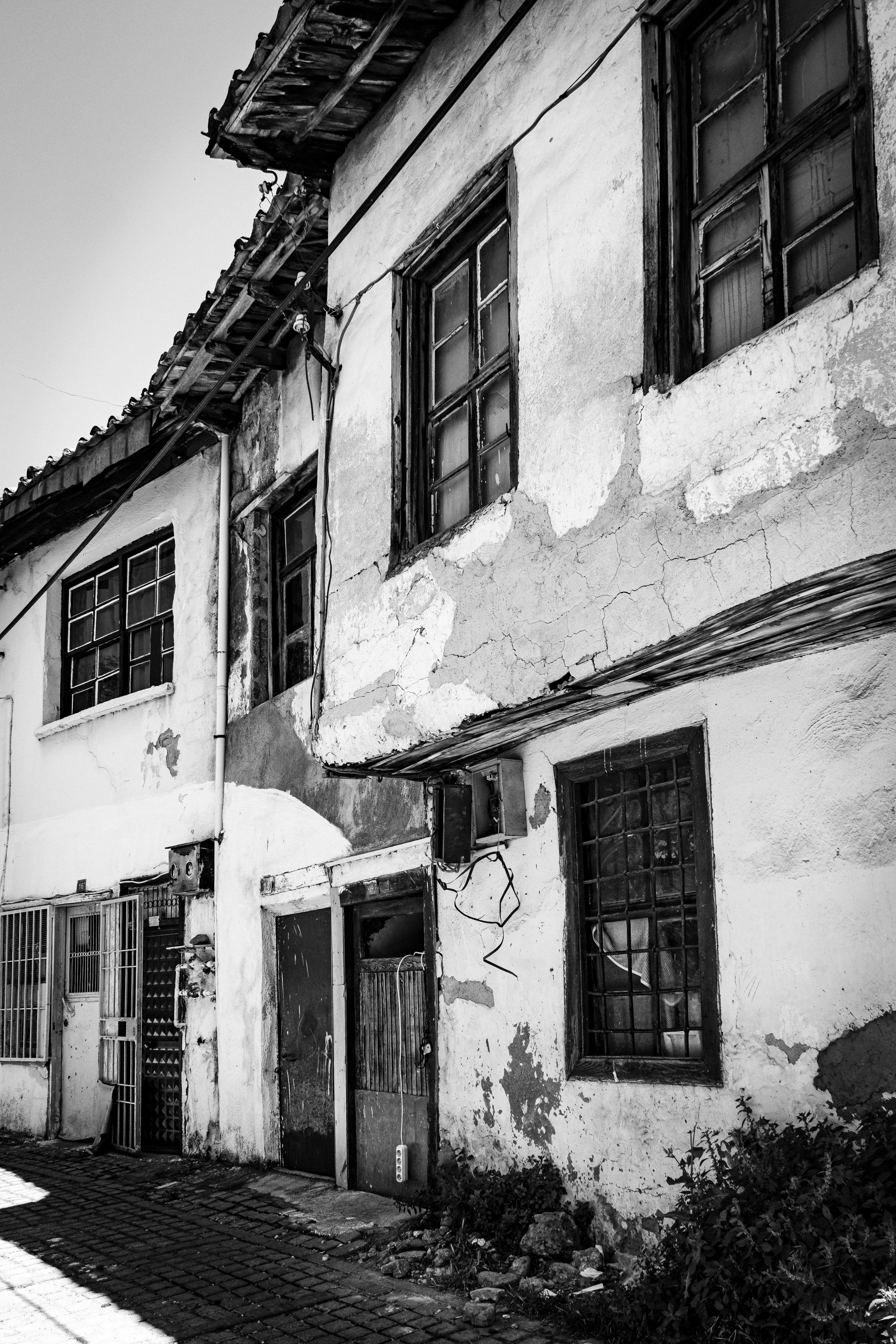 Weathered Facade in Monochrome: A Century of Cracks