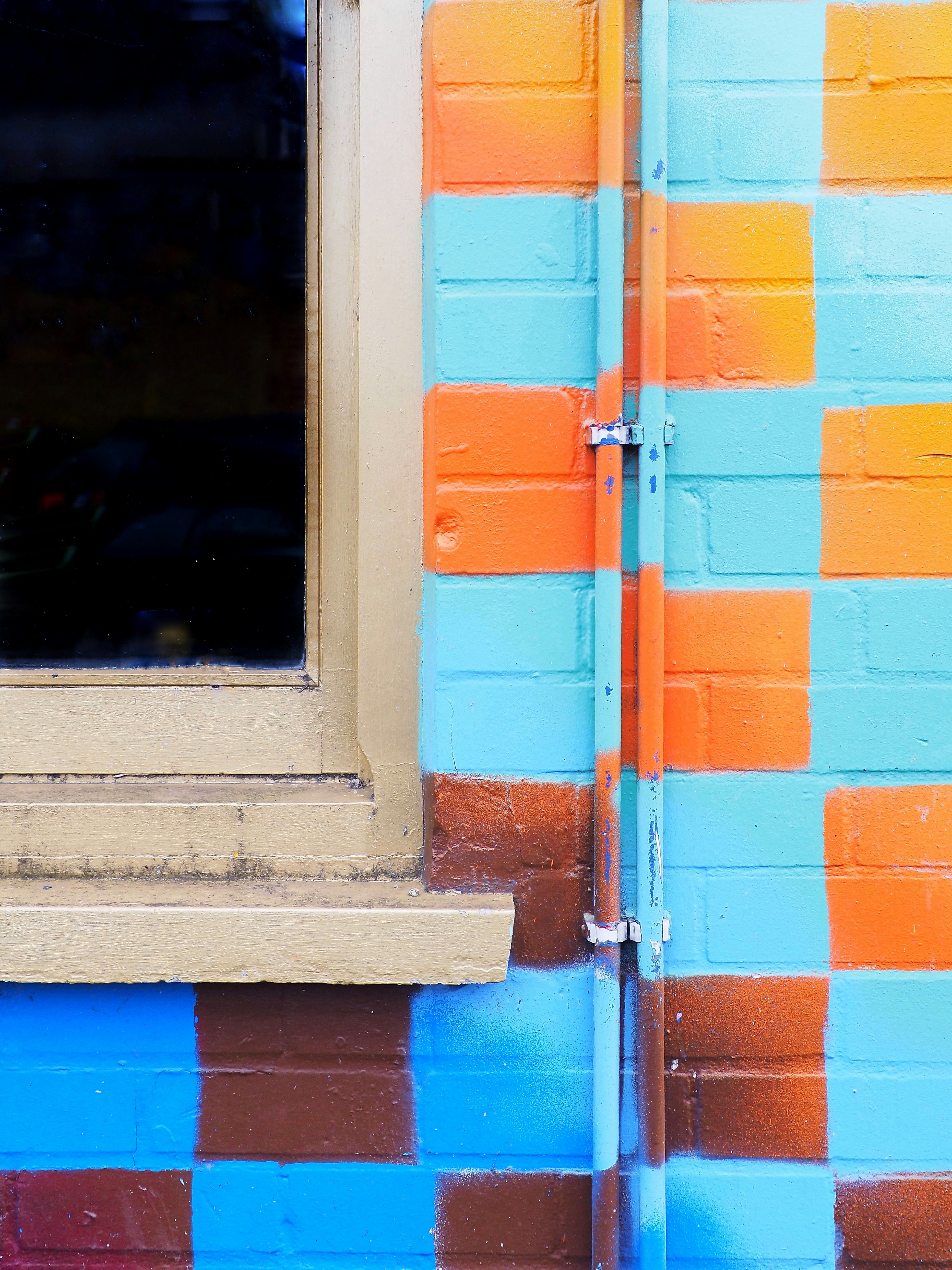 Vibrant Urban Brickwork: A Colorful Pipe Corridors