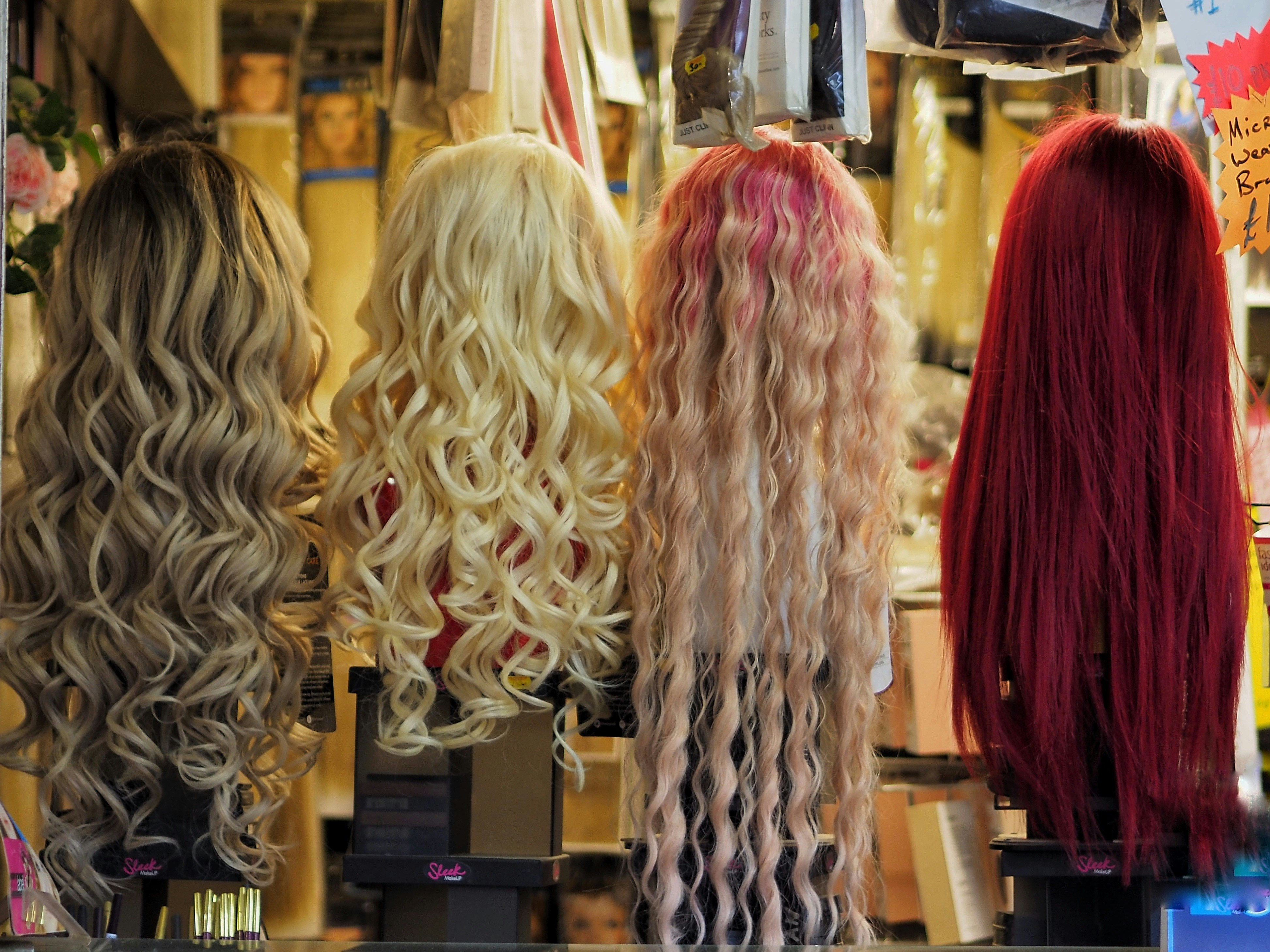 Vibrant Wefts: Strands of Color in a Wig Shop