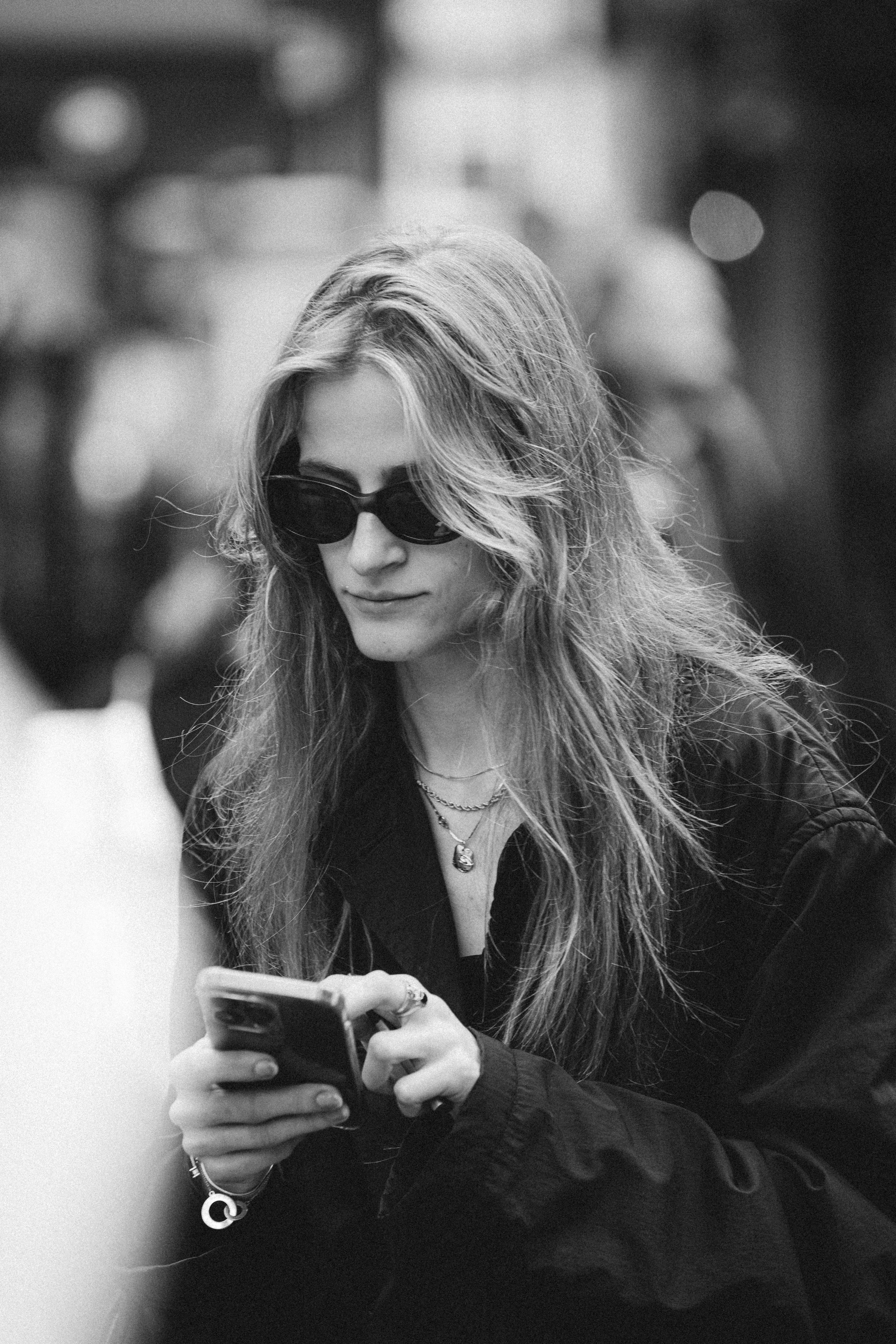 Sunglasses and Signals: A Quiet Moment in Black & White