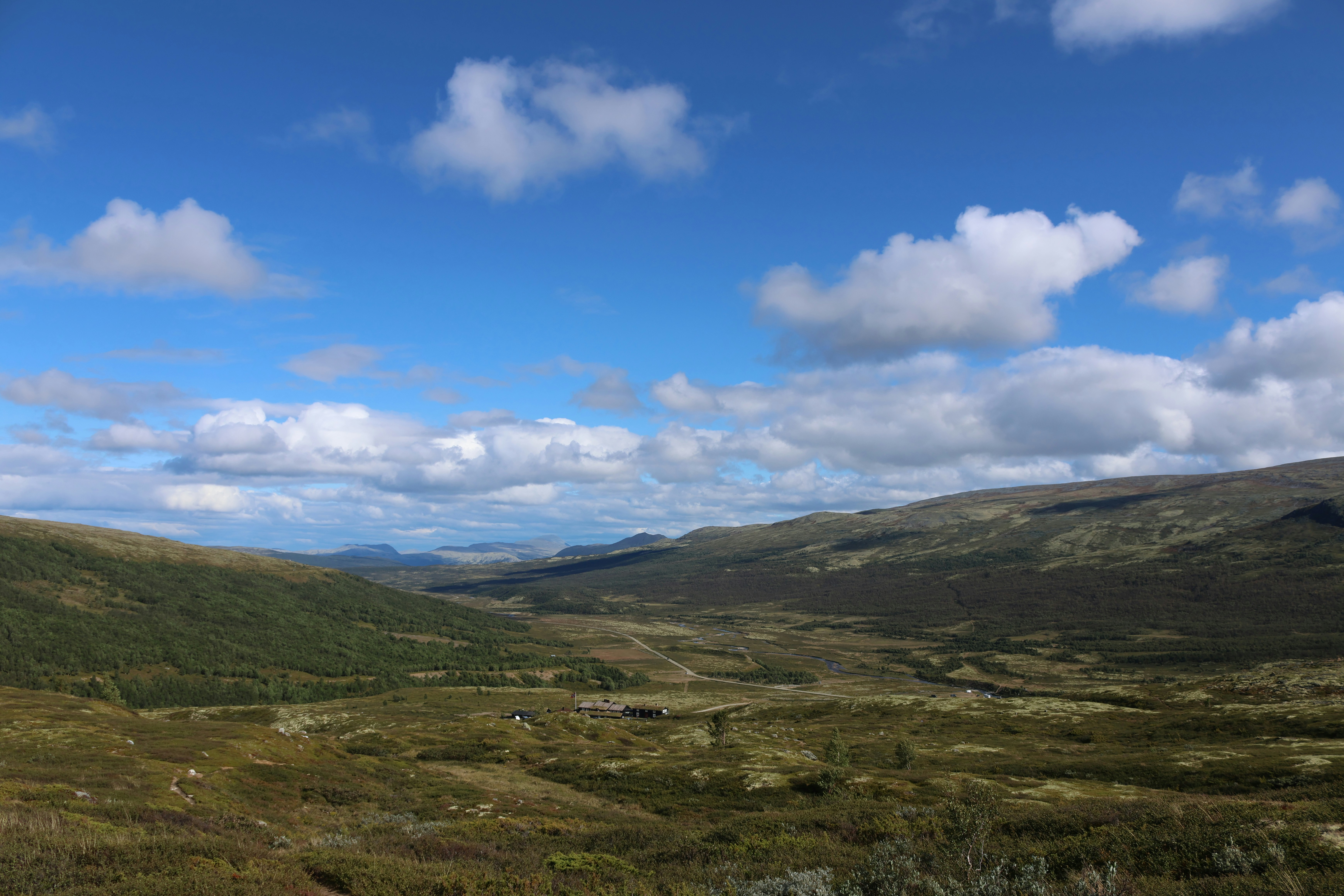Vast Highland Valley Under a Placid Sky