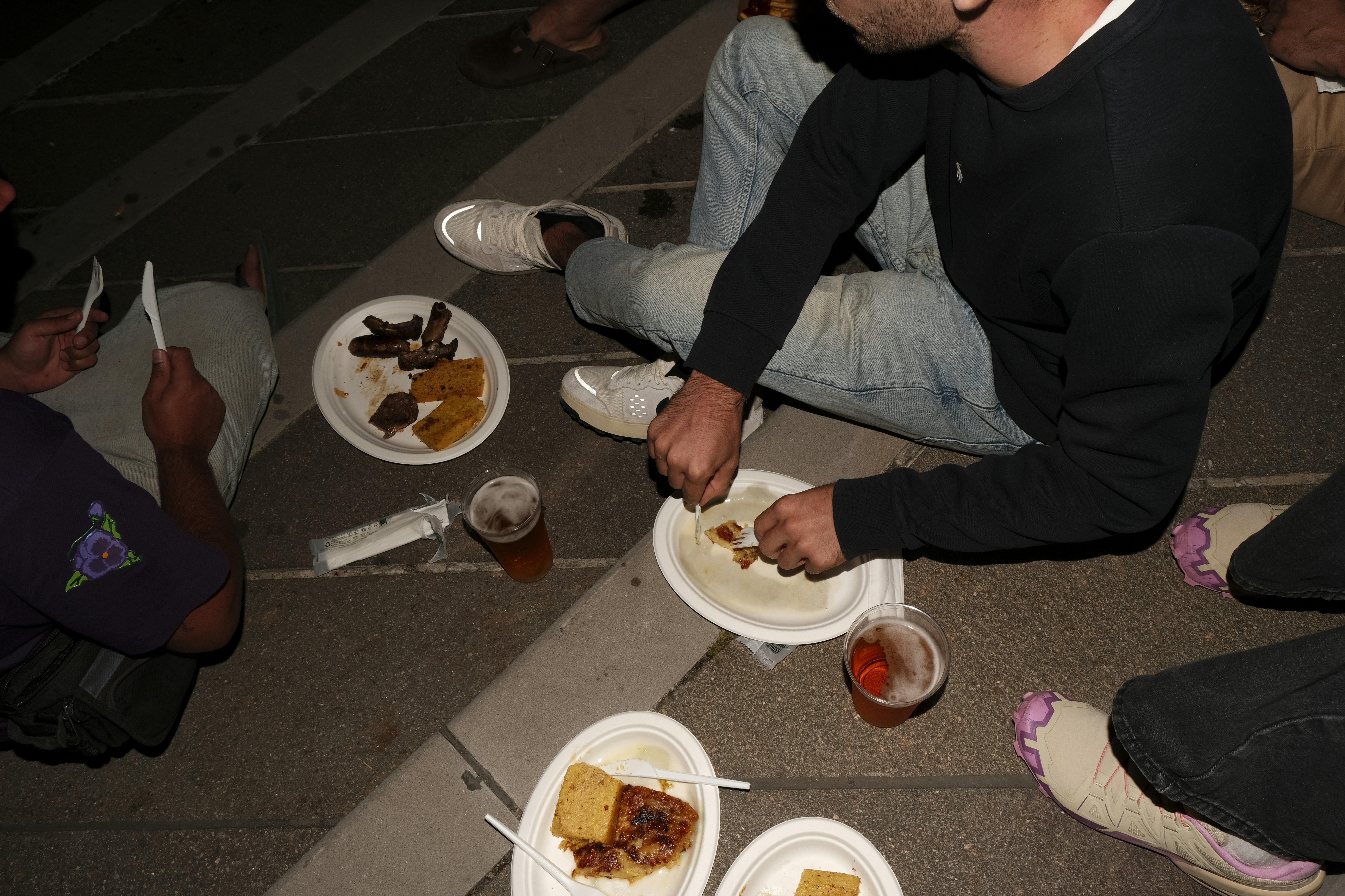 Midnight Snack Circle: Friends Gathered on a Street Feast