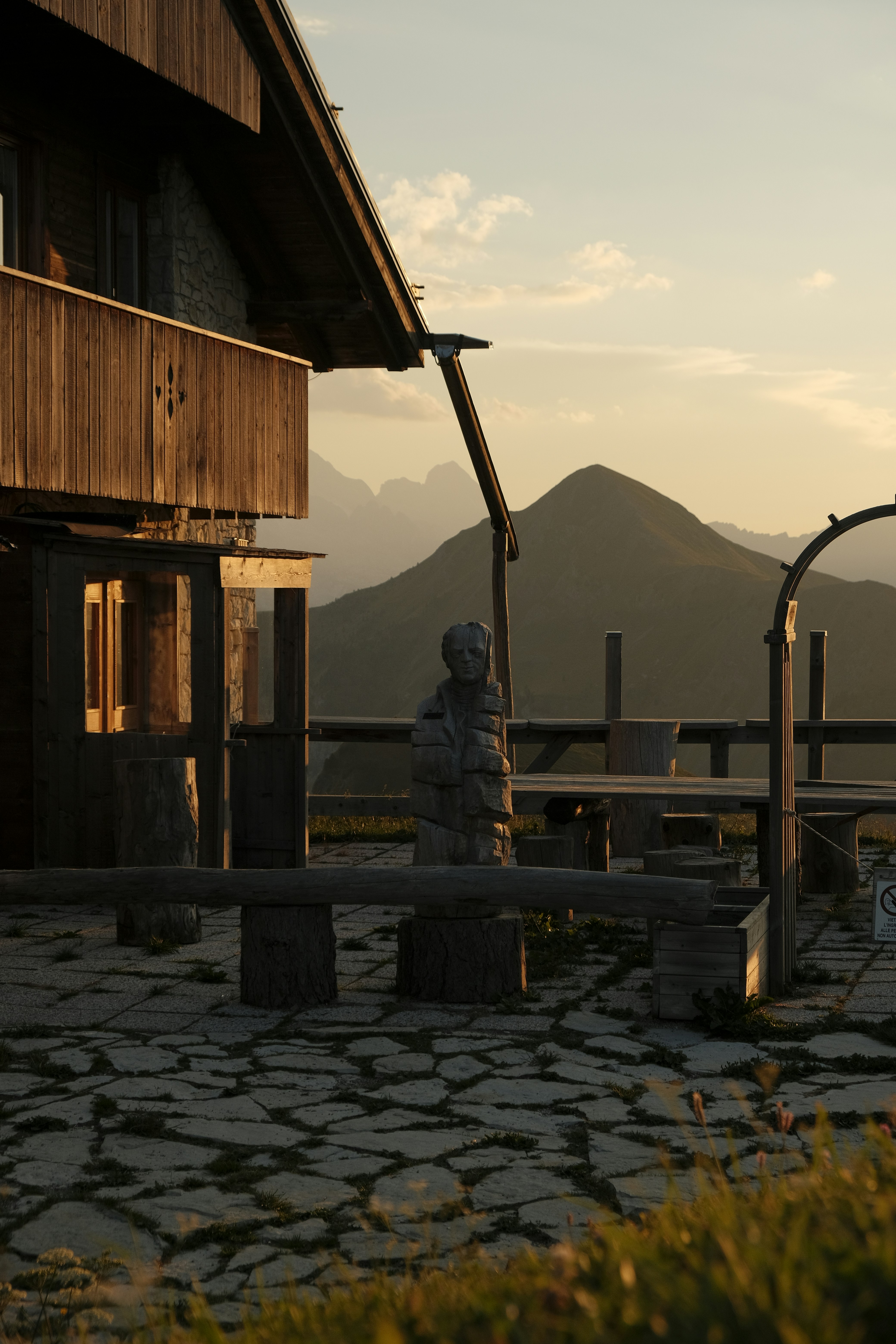 Sunlit Terrace Overlook with Alpine Silhouettes