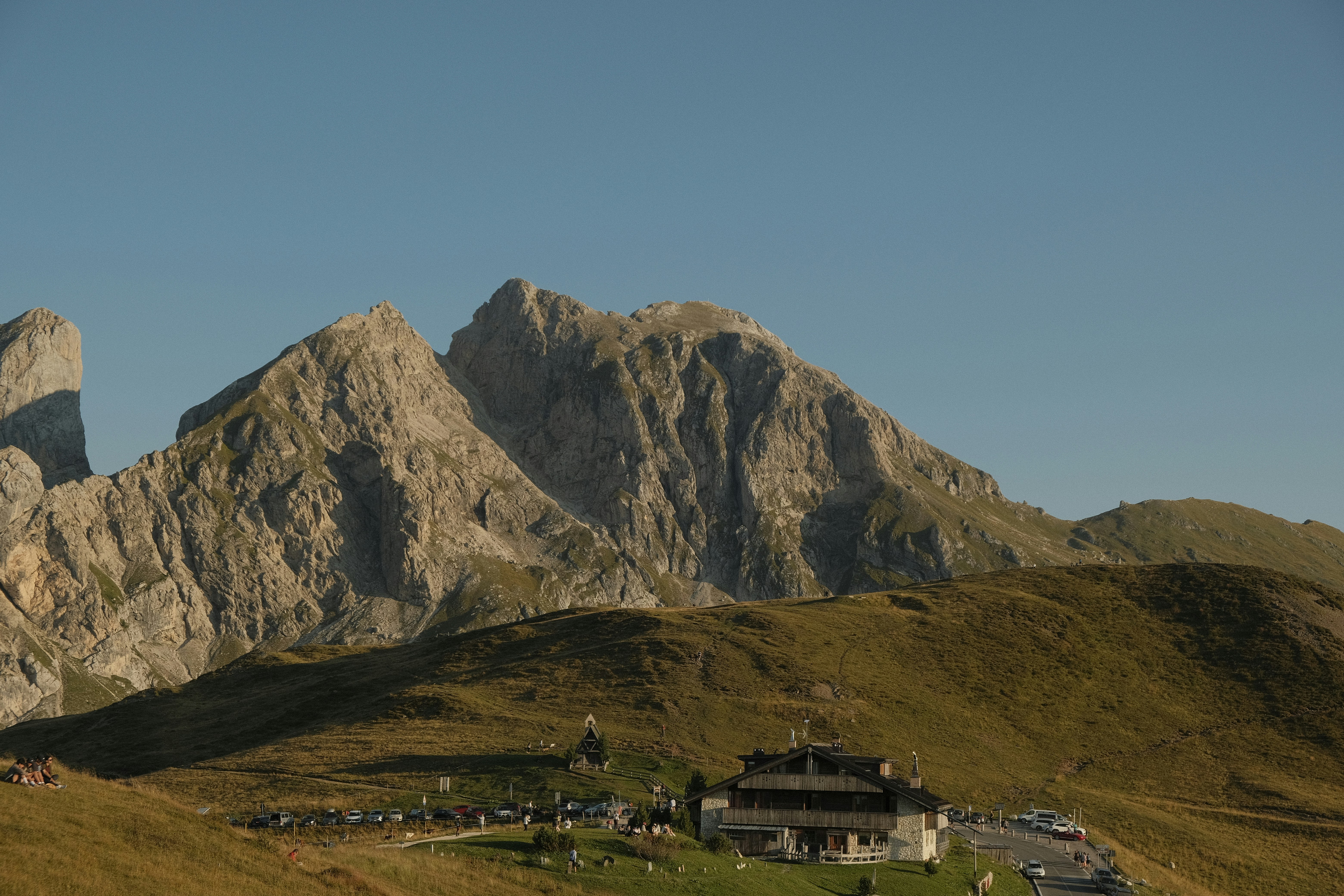 Mountain Monolith and Alpine Chalet at Dusk
