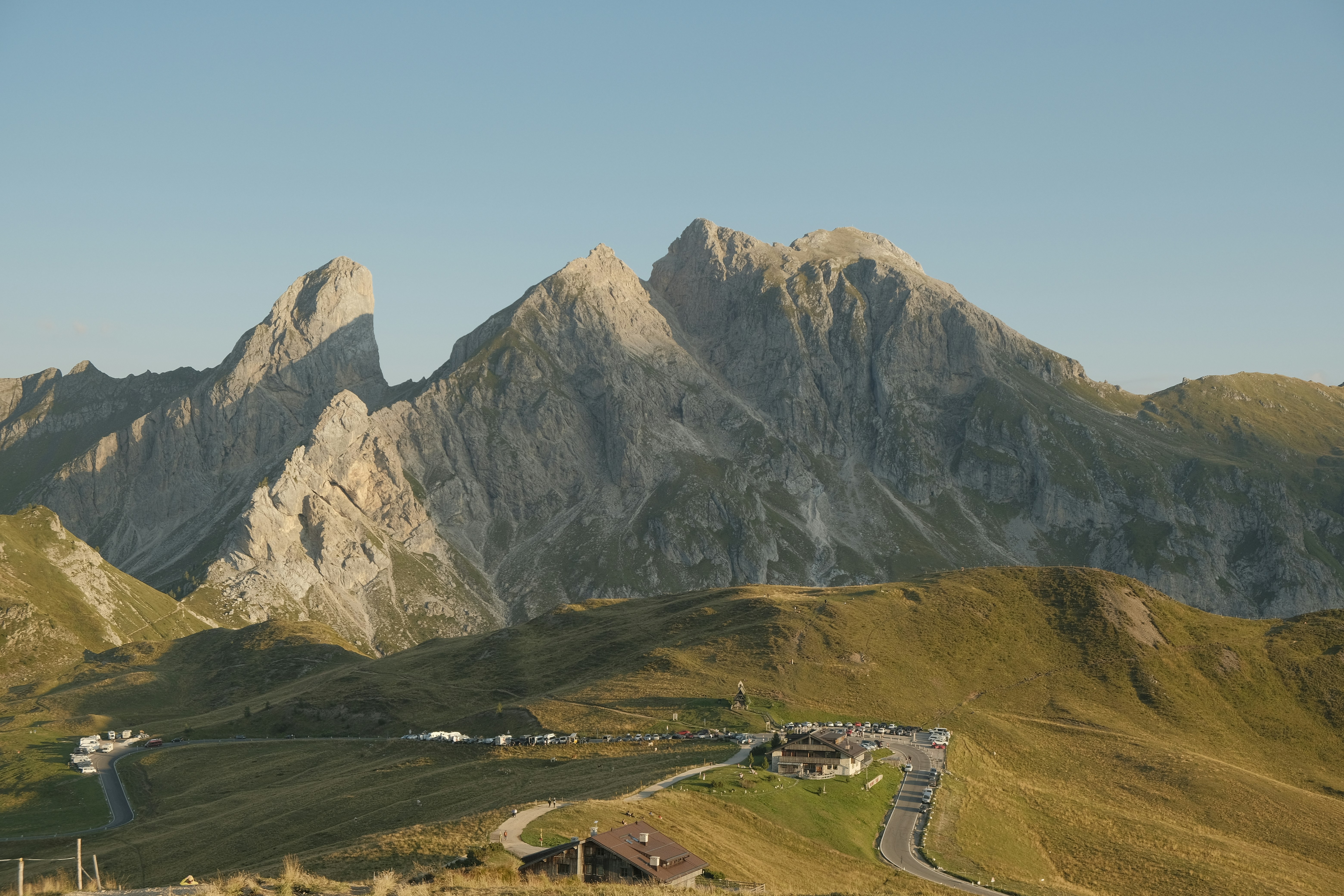 Lone Alpine Village Under a Majestic Ridge