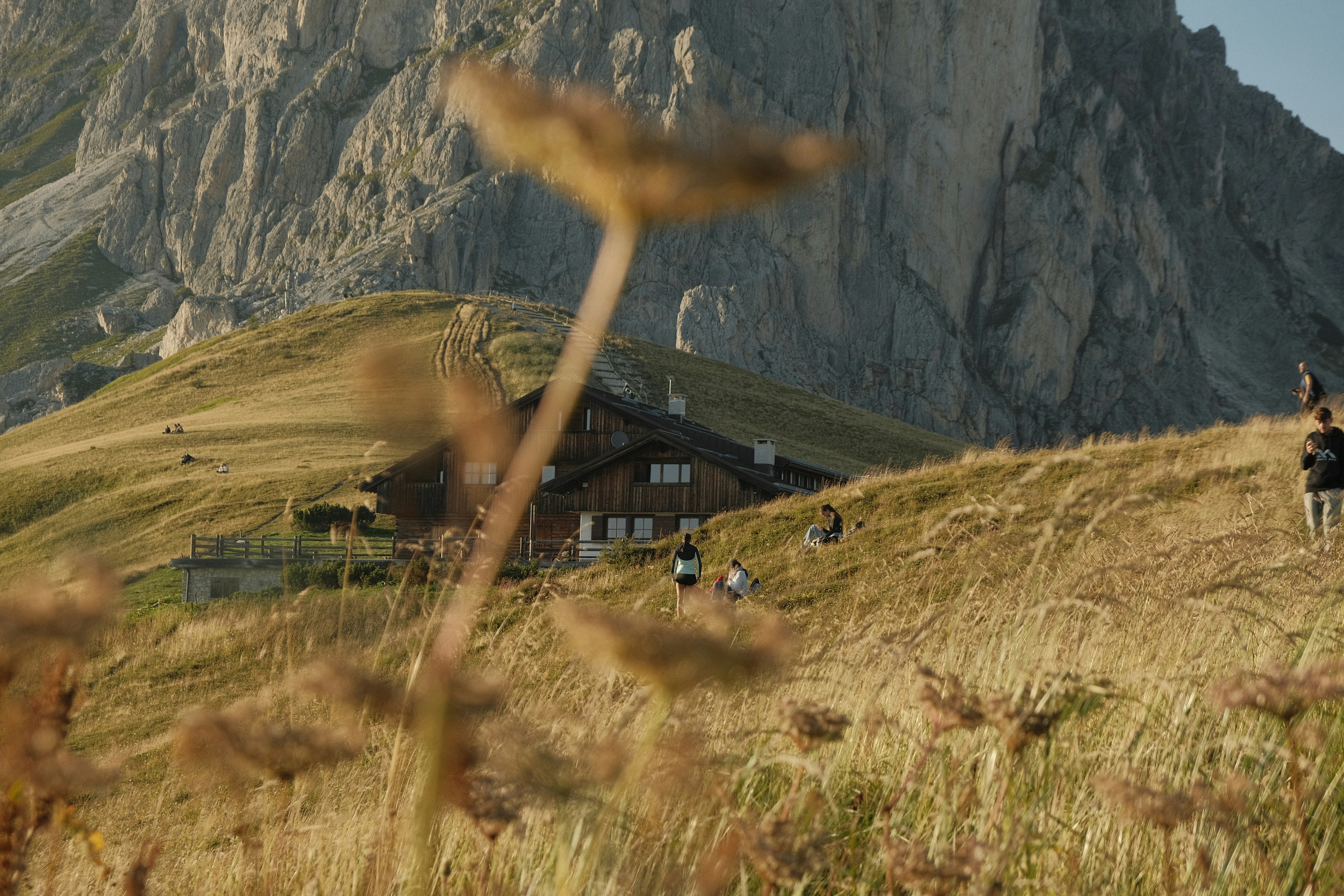 Sunlit Alps Lodge Amid Rugged Peaks