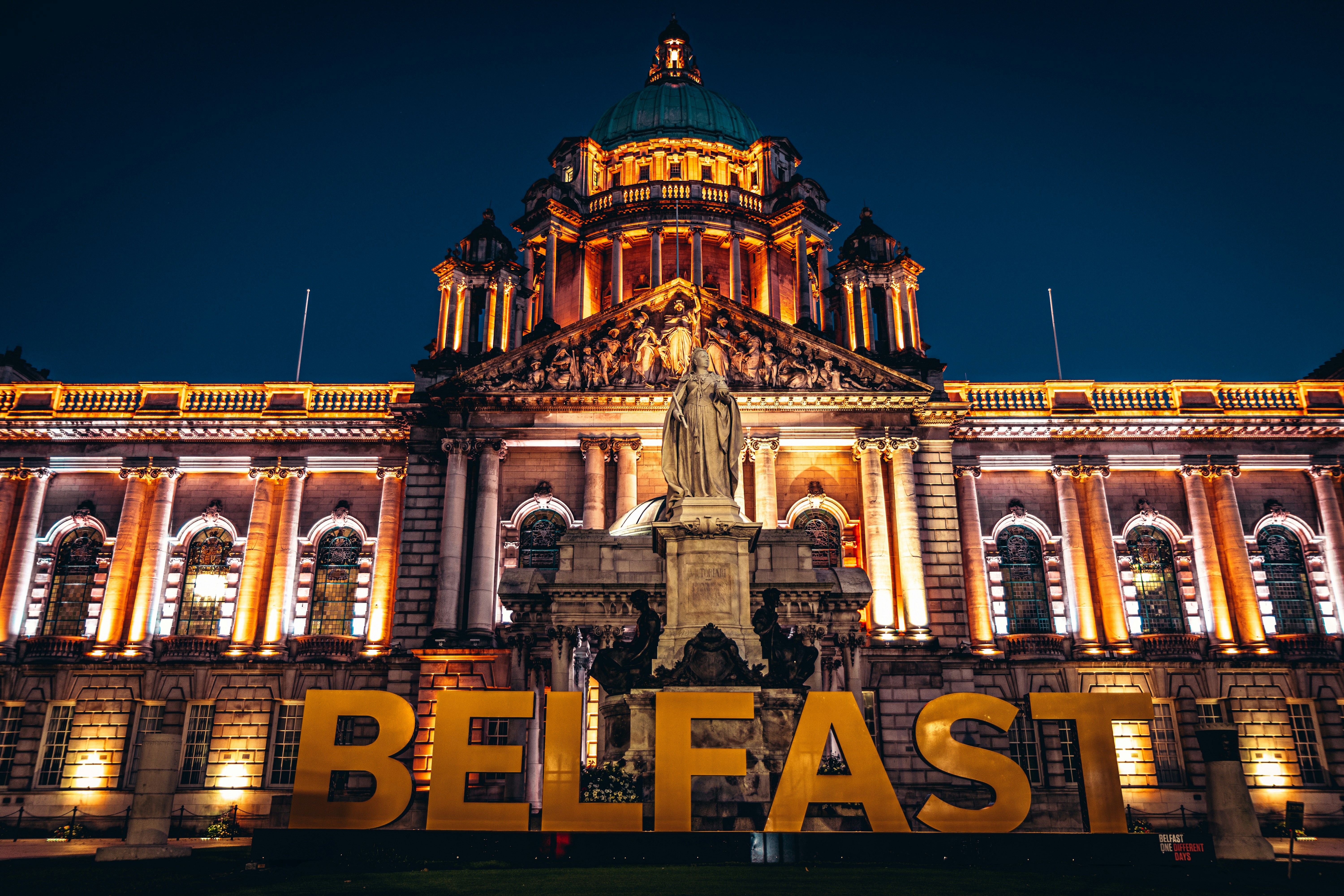 Belfast at Night: Monumental Glow Behind the Global Letters