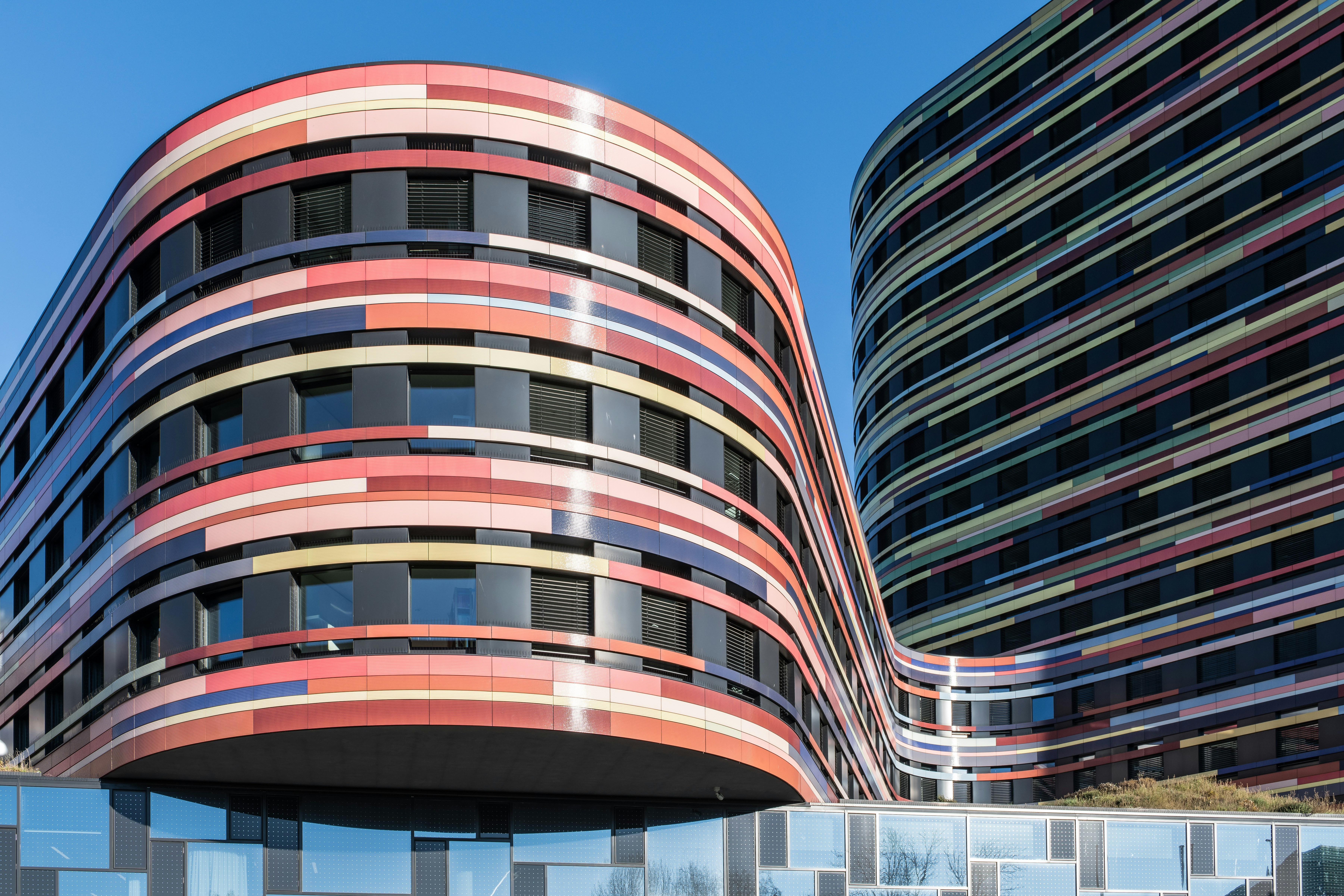 Curved Facades in Harmony: Stripes of Color on Modern Architecture
