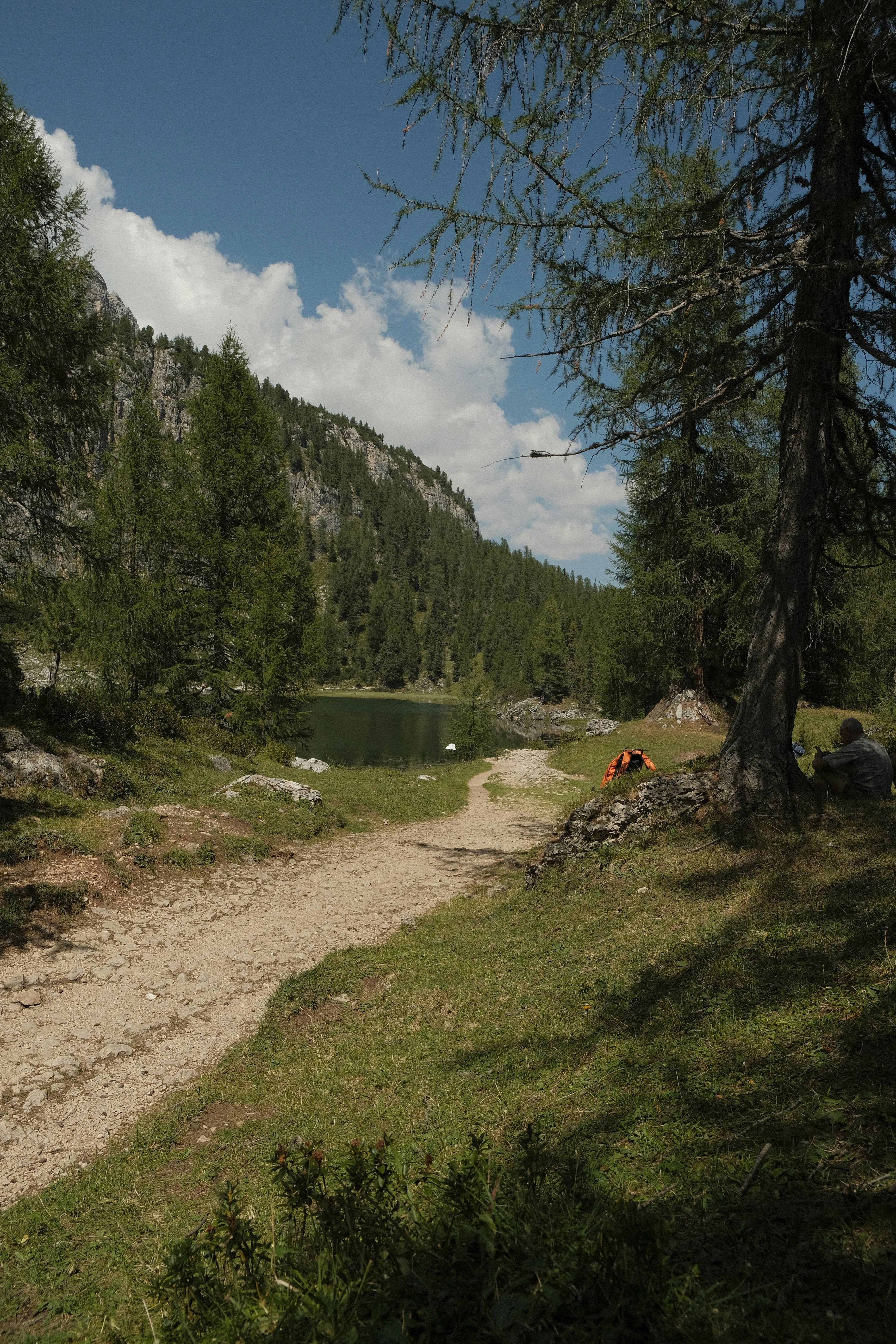 Trail by the Quiet Lake: A Mountain Vista Under Open Sky