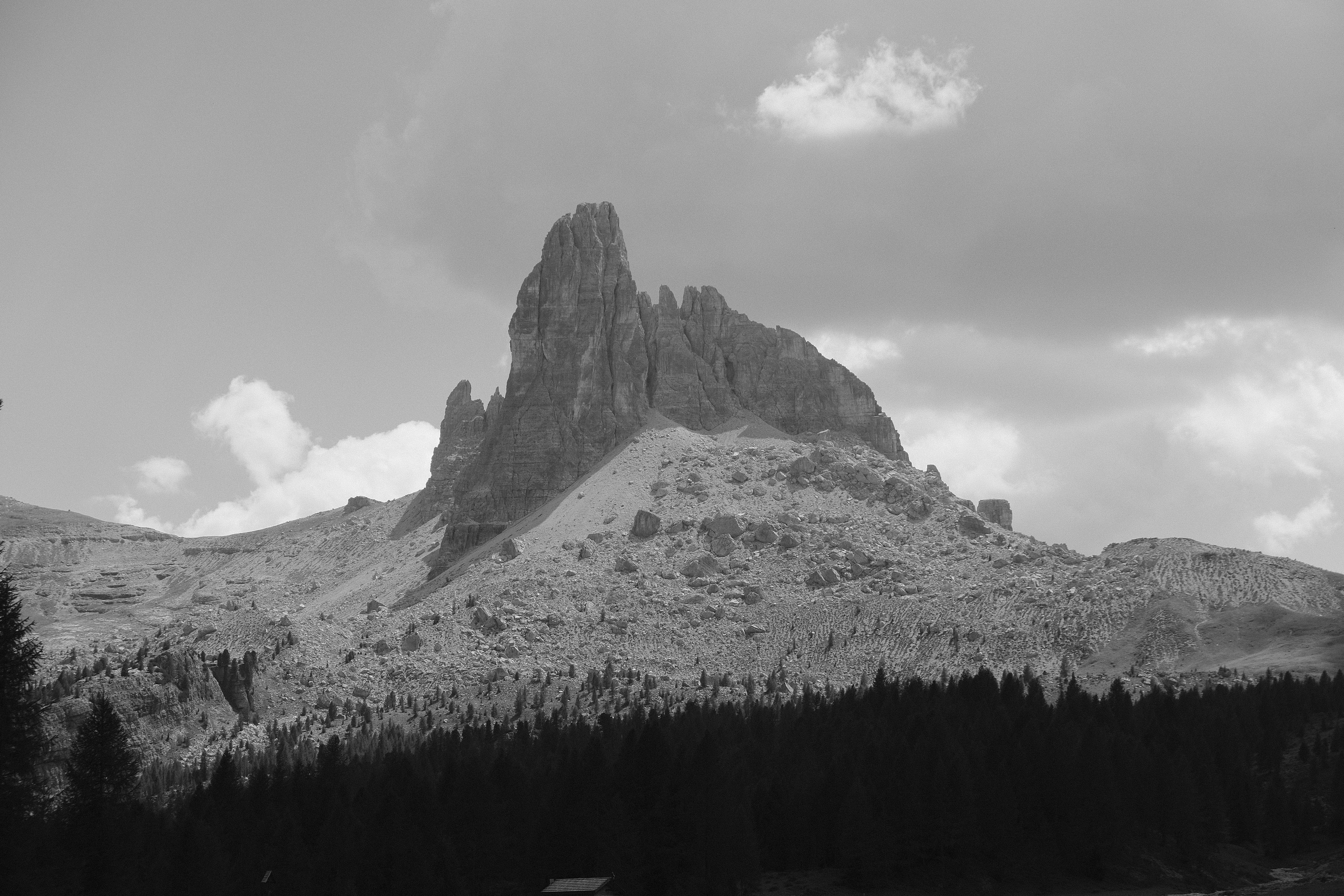 Towering Peak Above a Forested Foothill