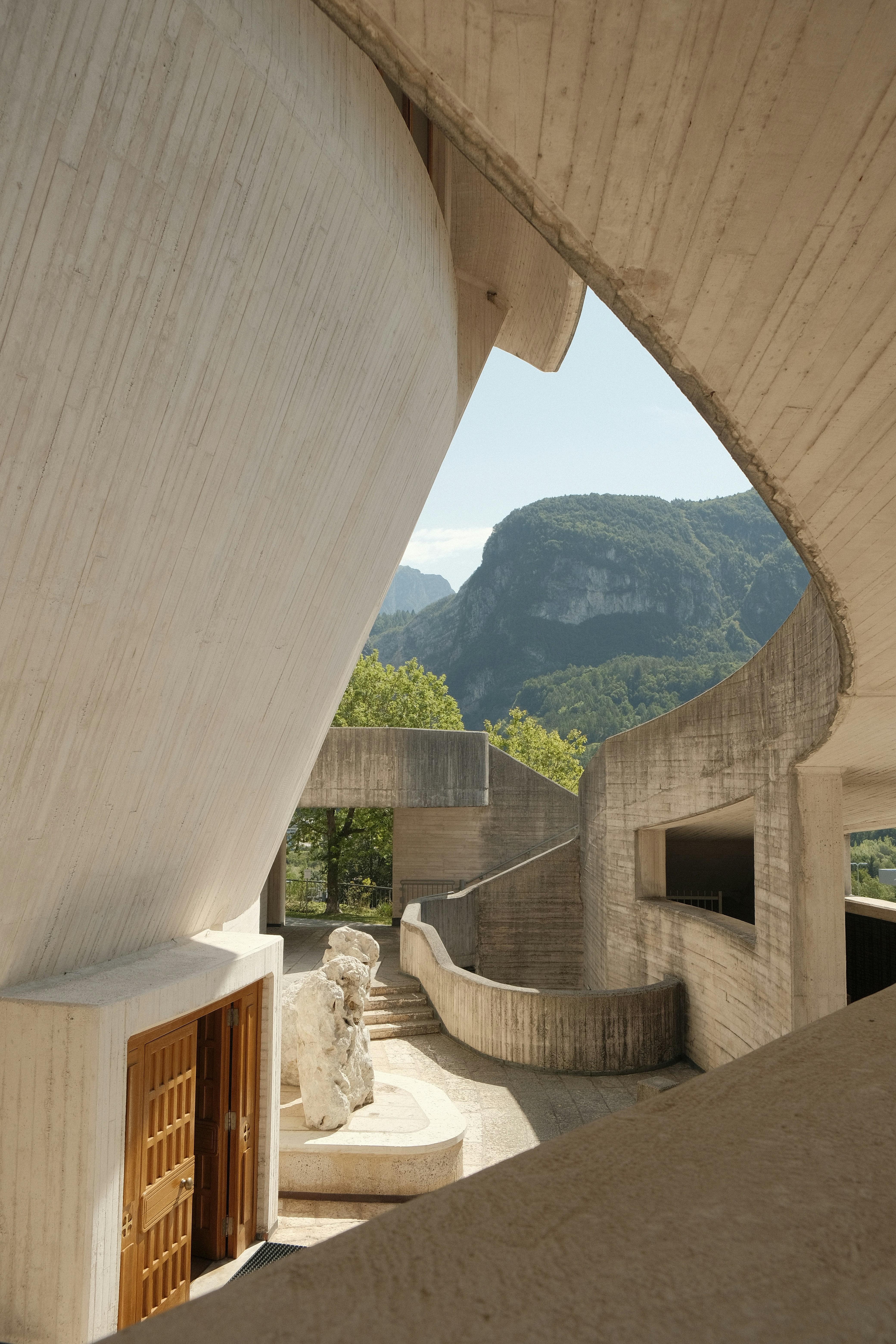 Curved Concrete Gallery Framing a Mountain Vista