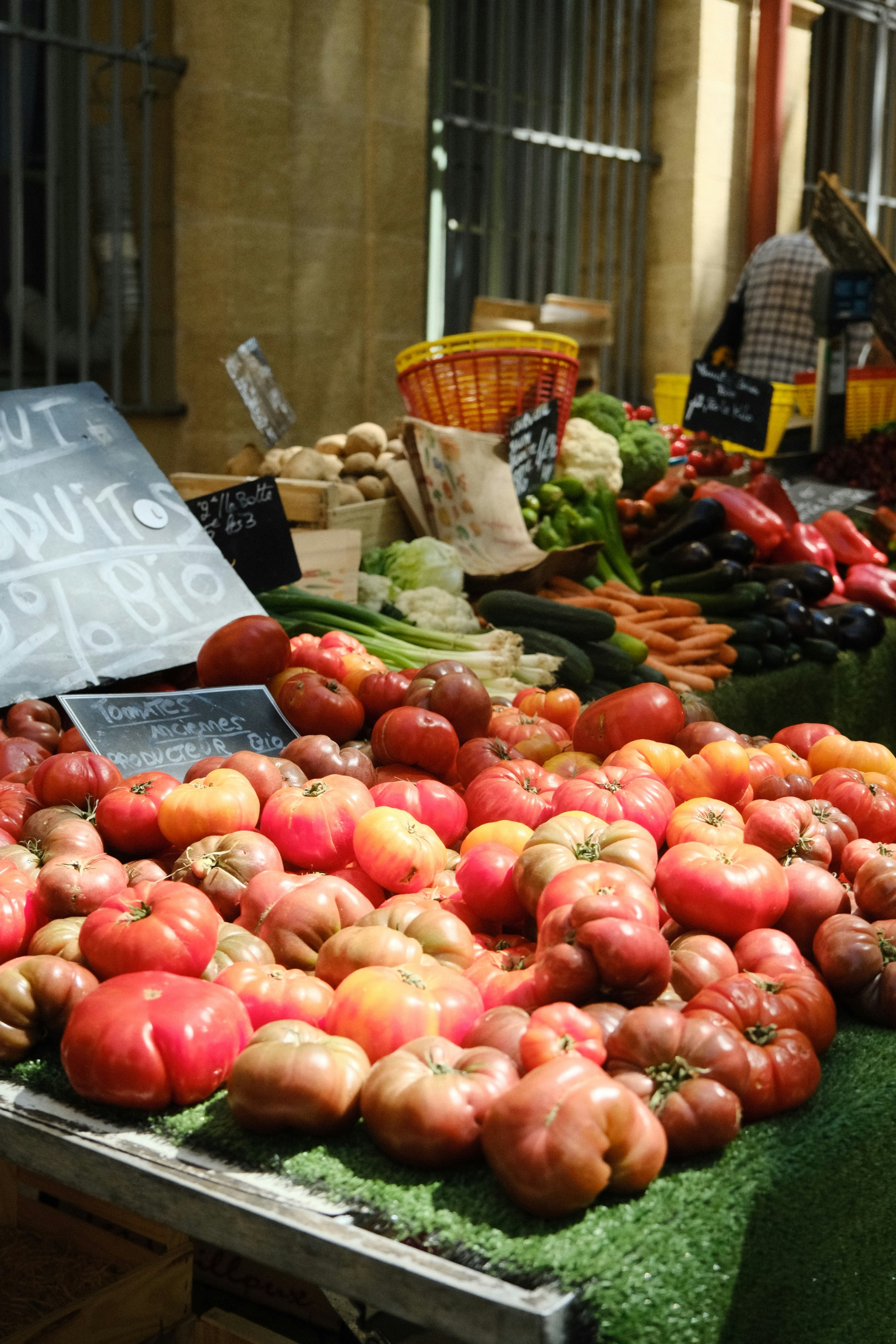 Crimson Tomatoes at a Sunlit Market Stand