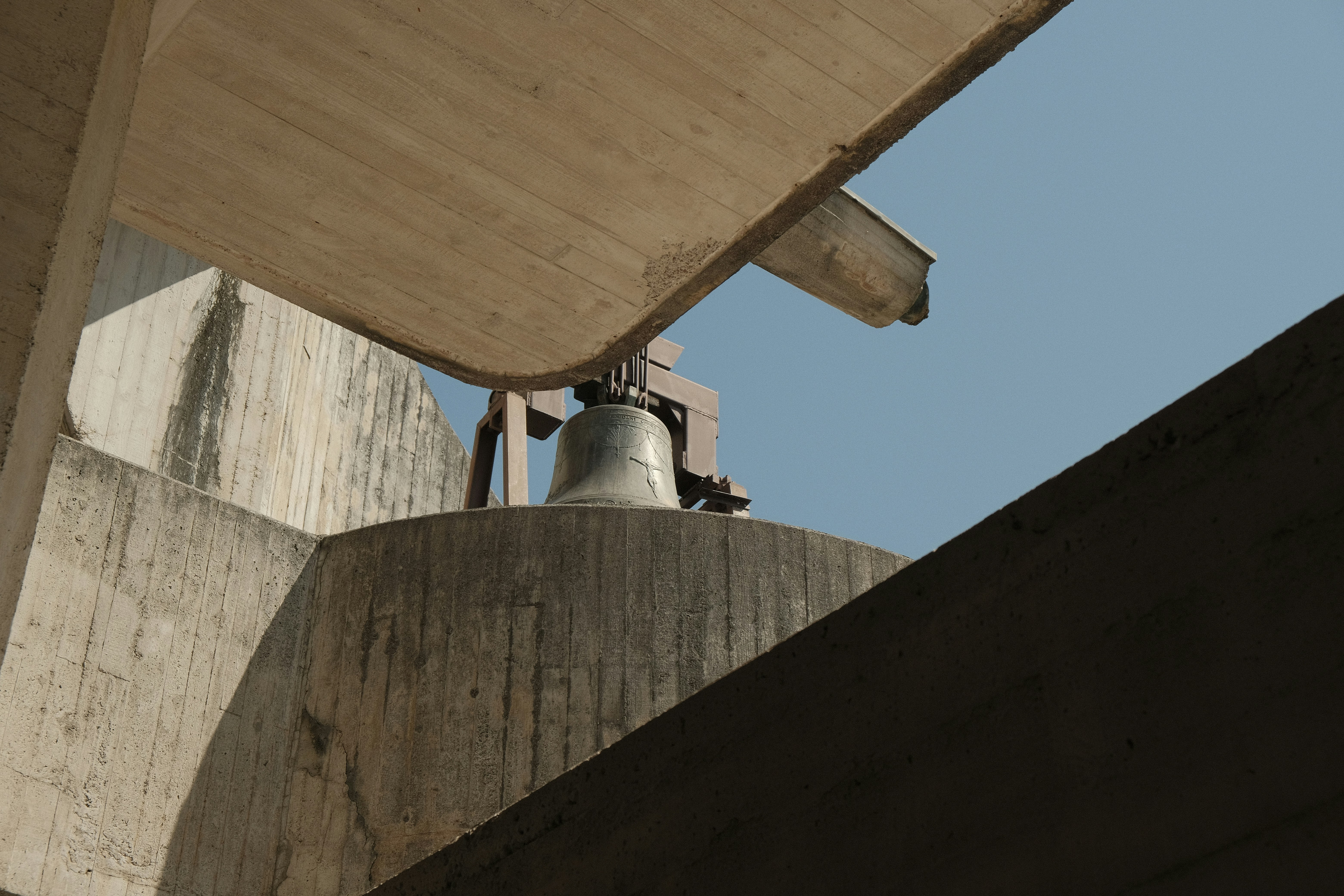 Concrete Dune: A Sunlit Mechanical Moment Between Angles