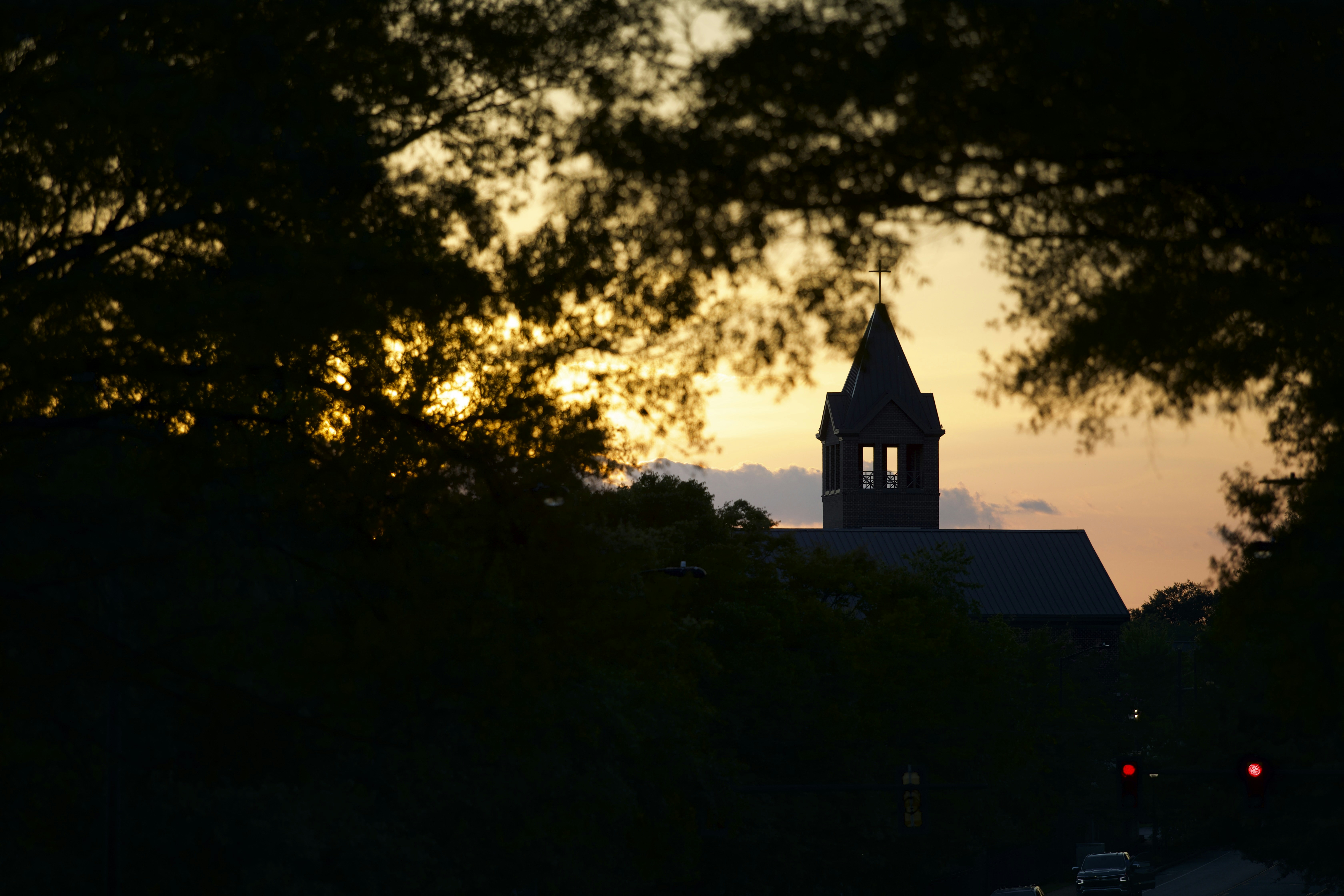 Silhouette at Dusk: A Clock Tower Trimming the Horizon