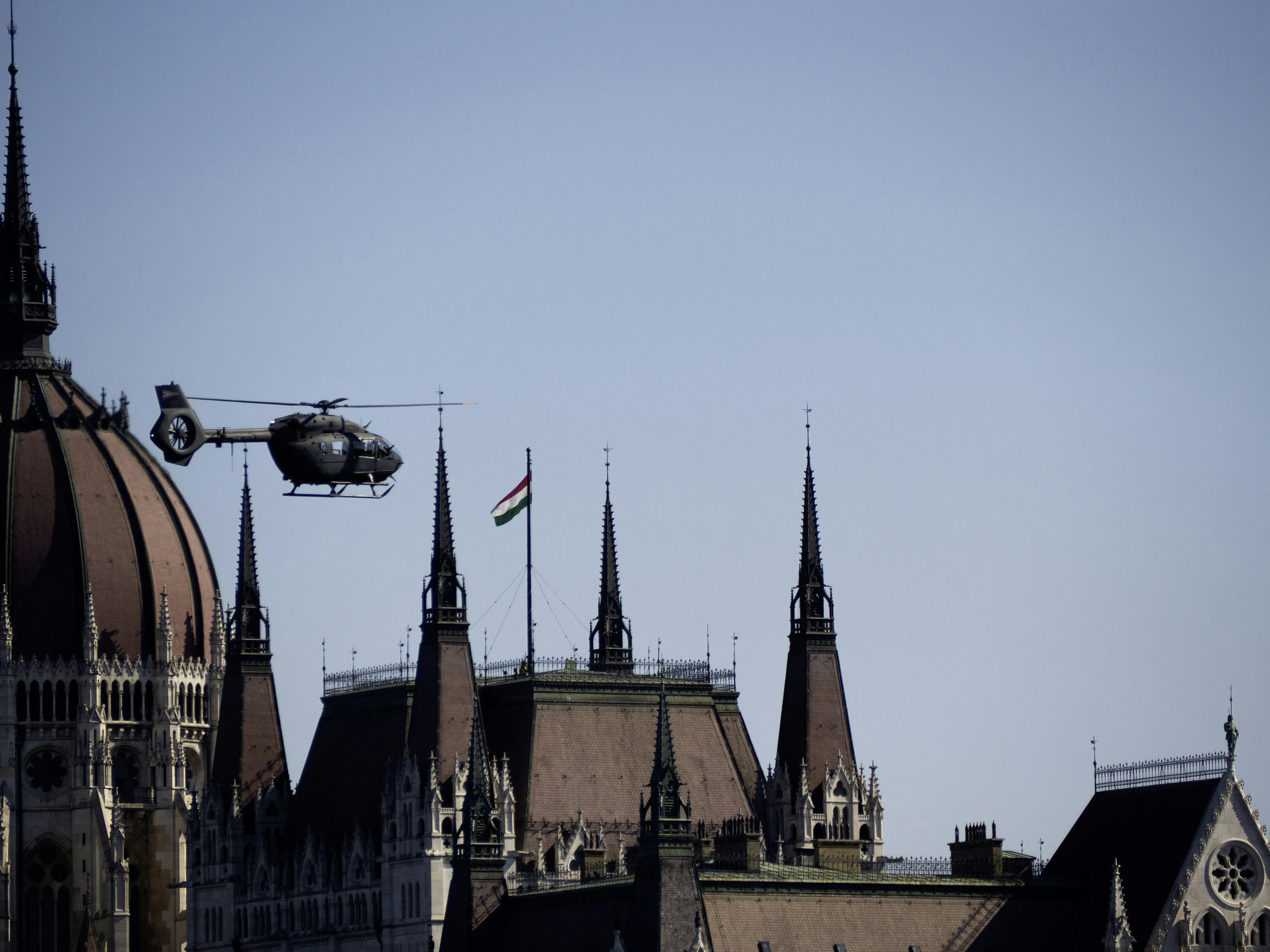 Overhead View: A Historic Skyline Under a Passenger Helicopter