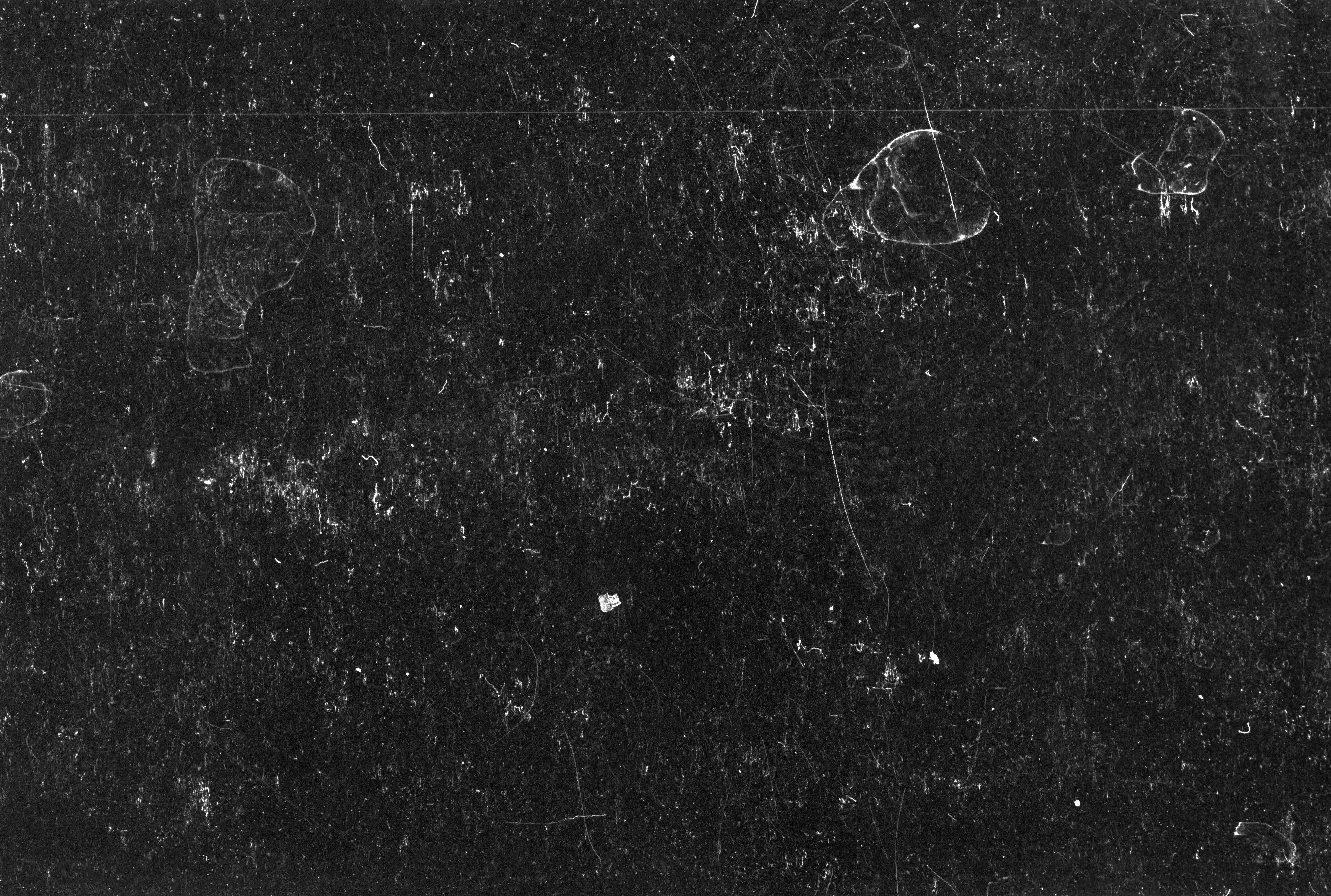 Dusty Scratchboard: A Hidden Surface in a Cracked Black Field