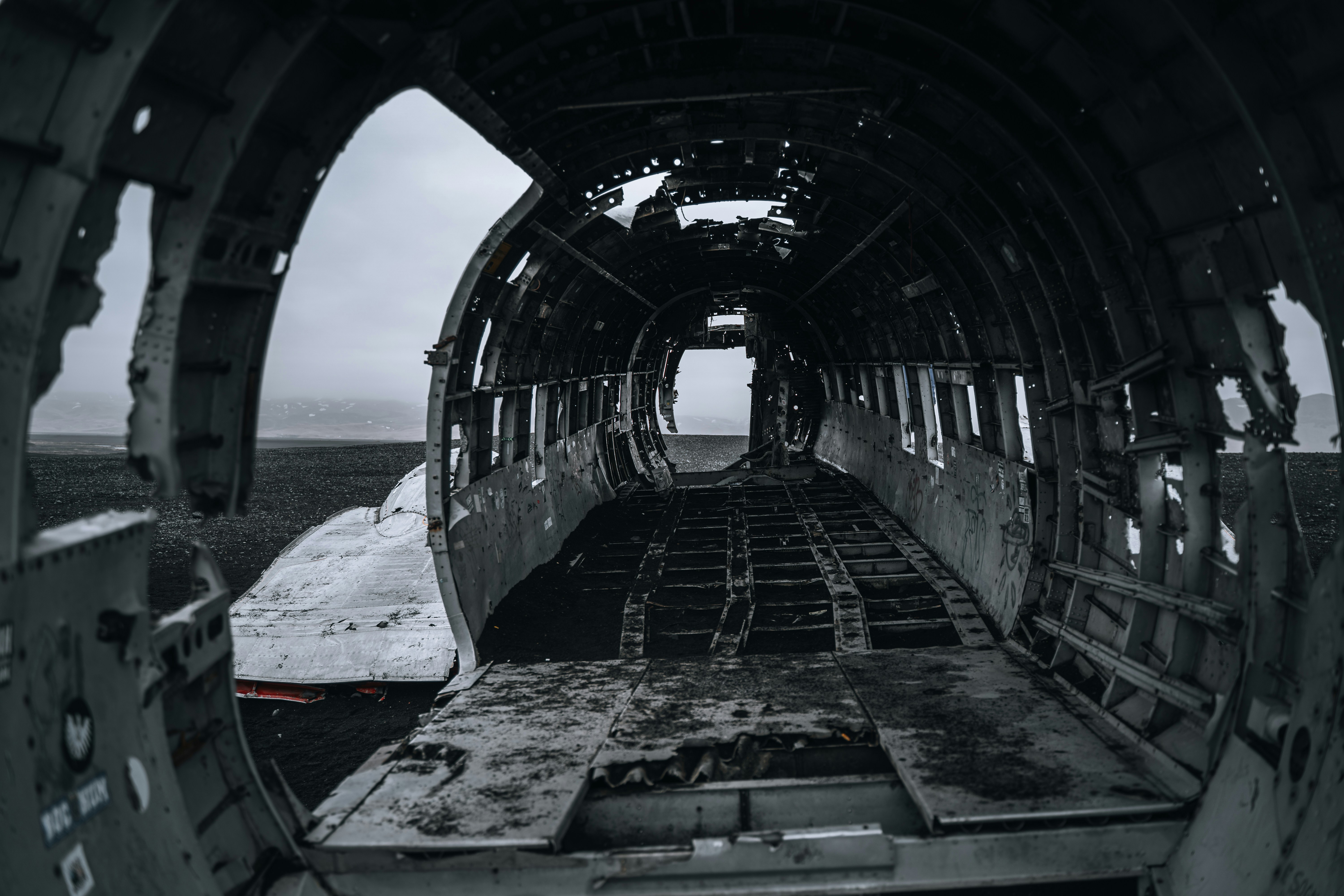 Deserted Aircraft Hull: A Tunnel of Aged Steel