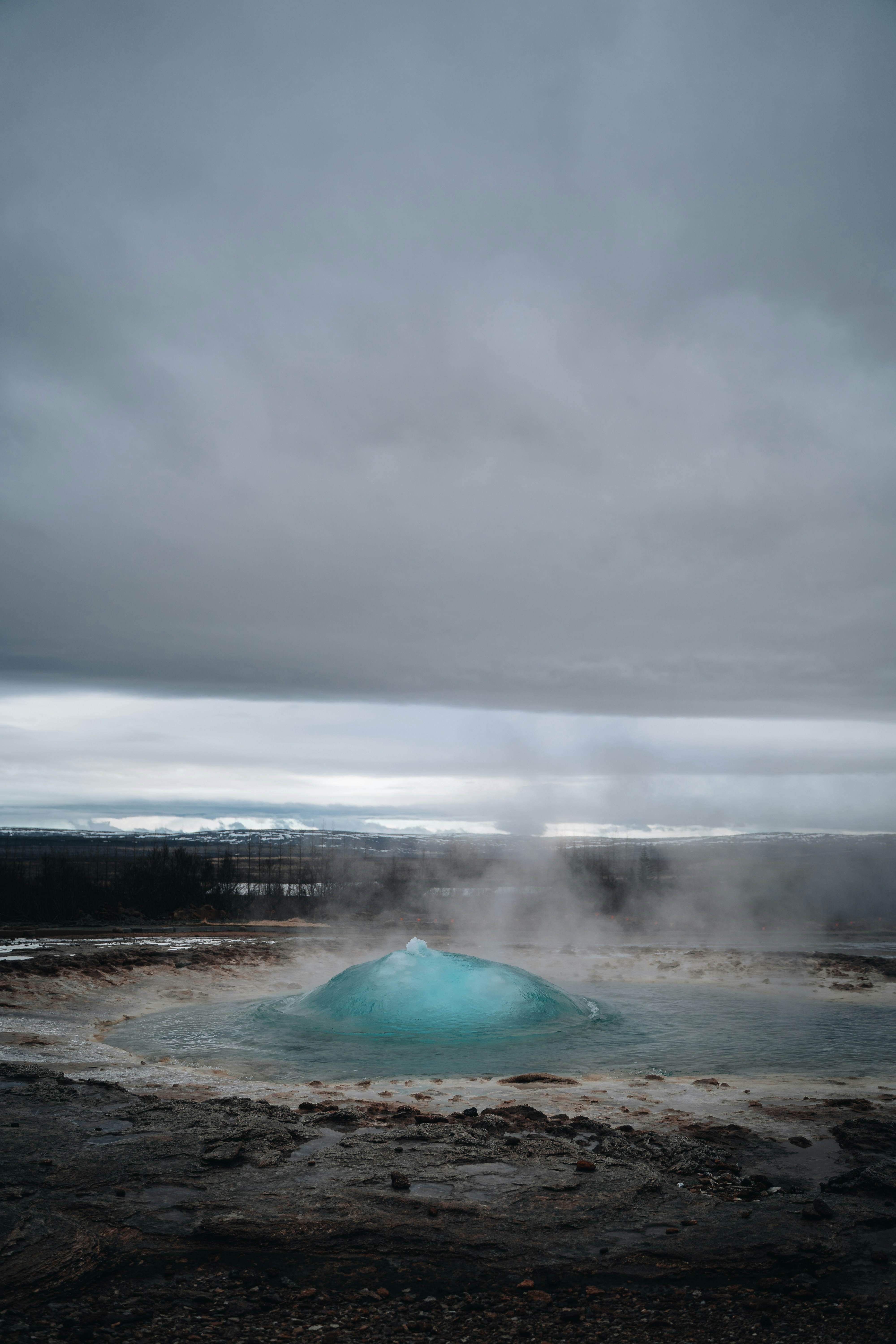 Blue Conical Bubble: A Steam-Pheated Spring Crowned by Steam