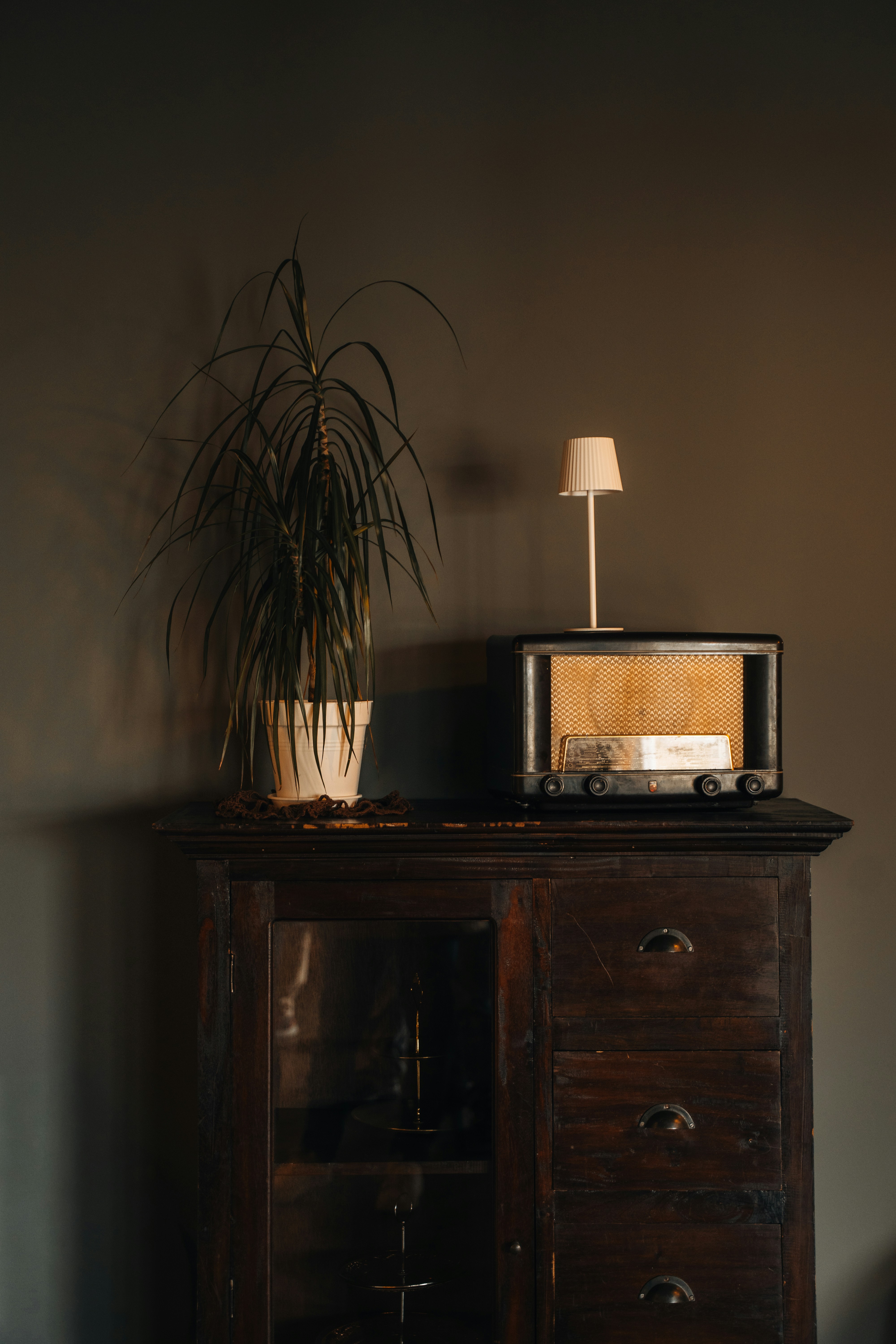 Midnight Retro: A Dusty Radio Reigns Over an Old Dark Console