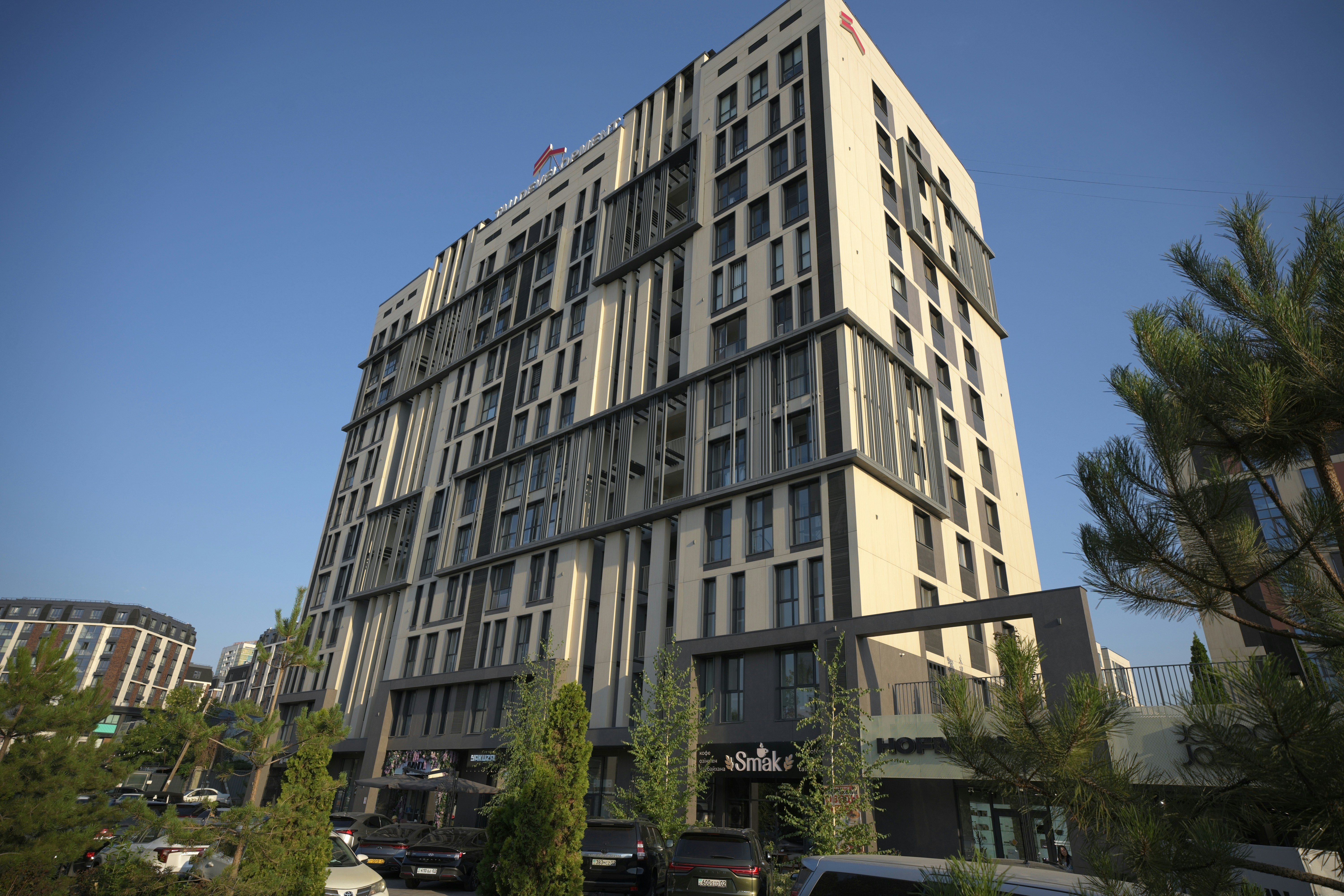 Vertical Studio: A Modern Apartment Block Reaching Toward a Clear Sky