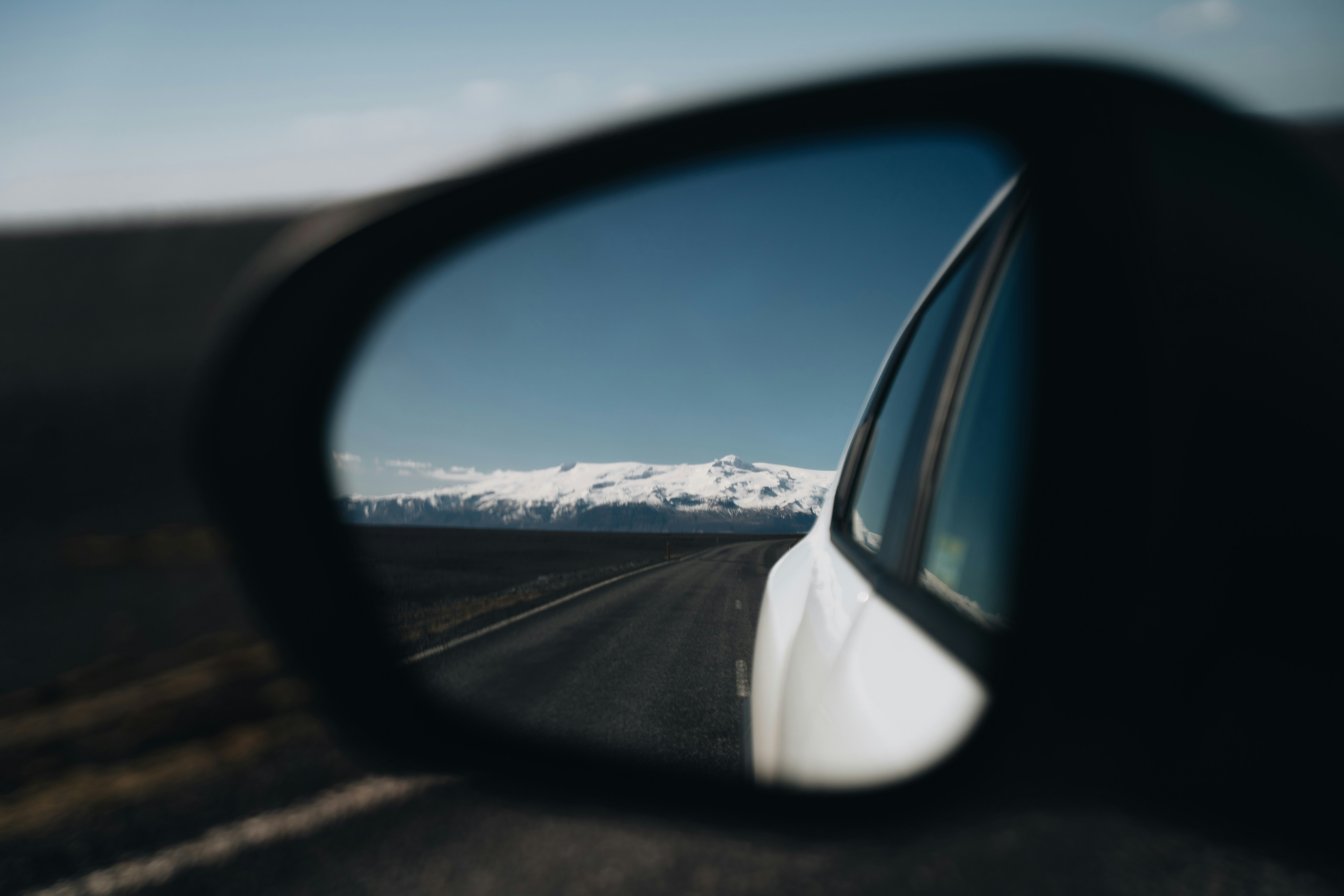Mirror Window to Snow-Capped Horizons