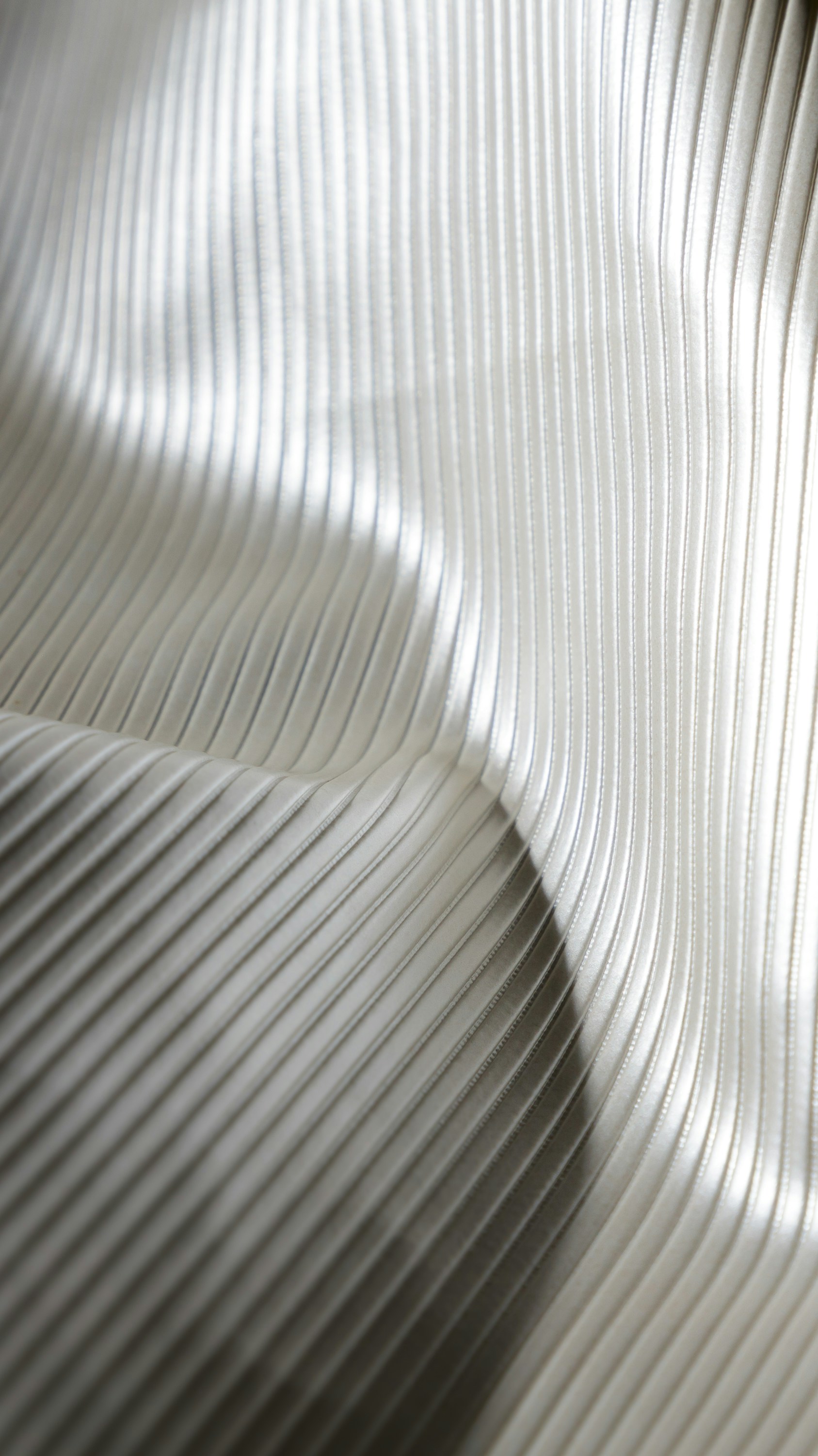 Ridges of Light: A Pleated Pattern in Soft Silver