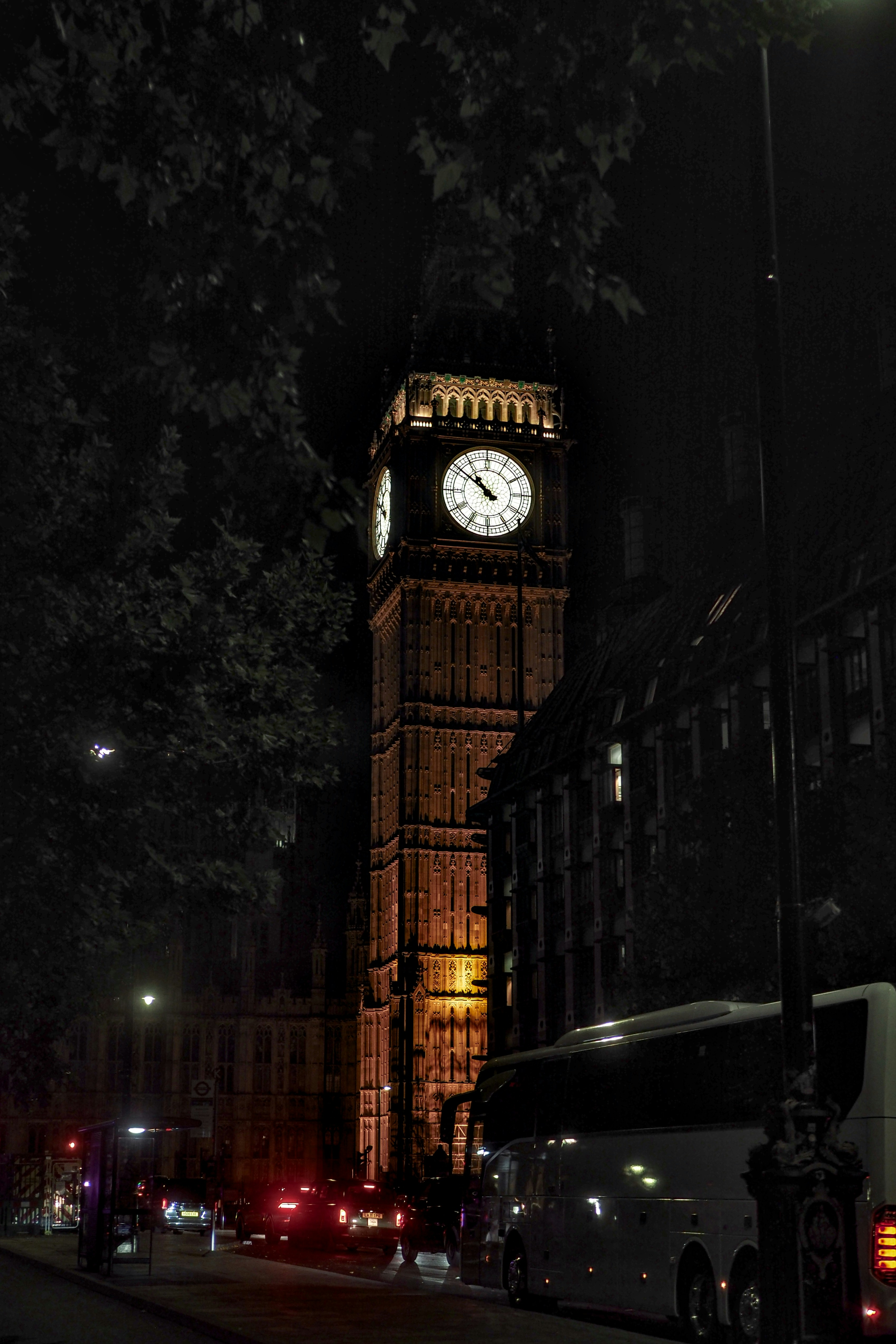 Midnight Glance at Westminster: Clock Tower in Quiet Streetlight