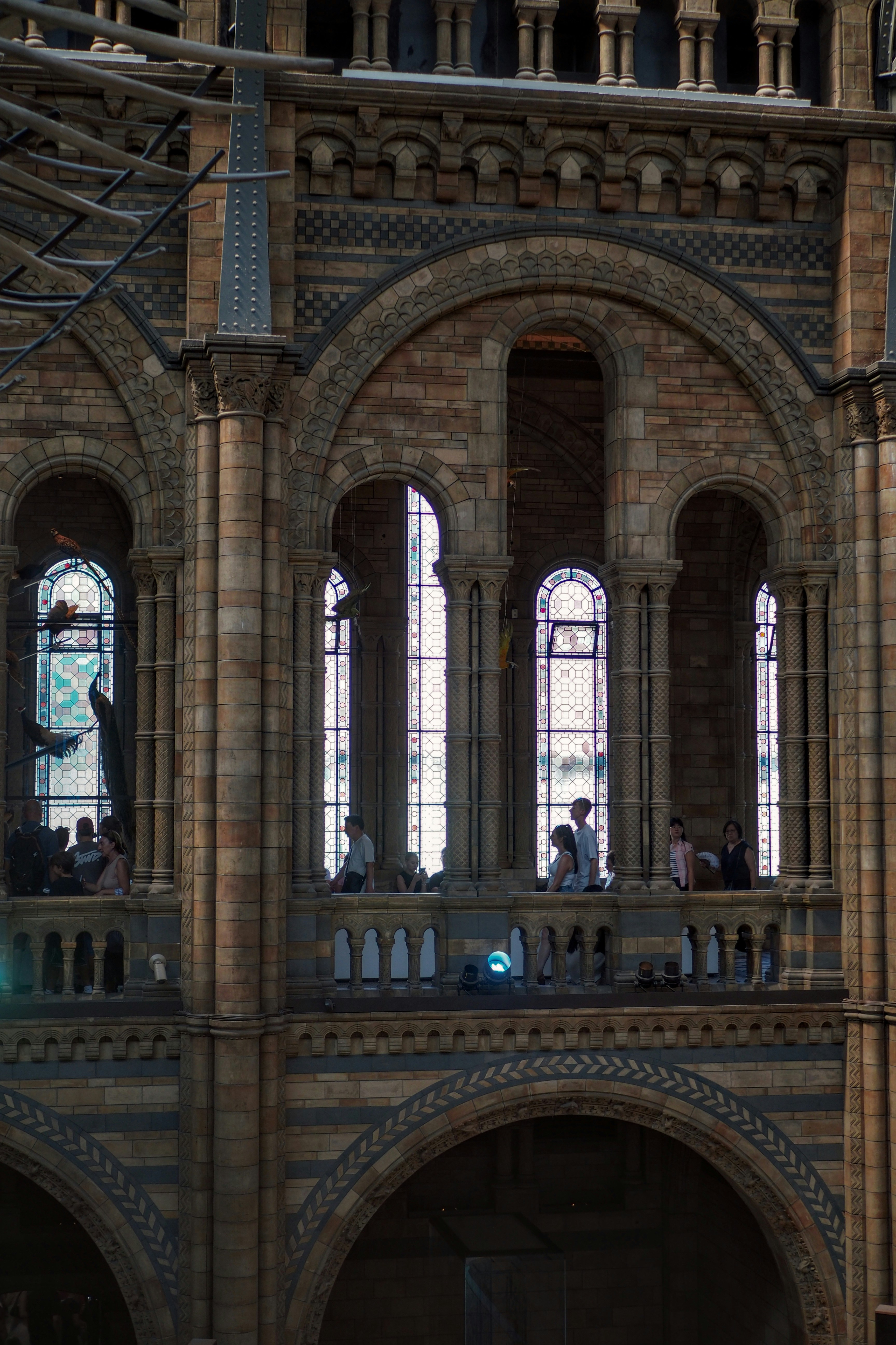 Architectural Echoes: Visitors in the Arched Atrium