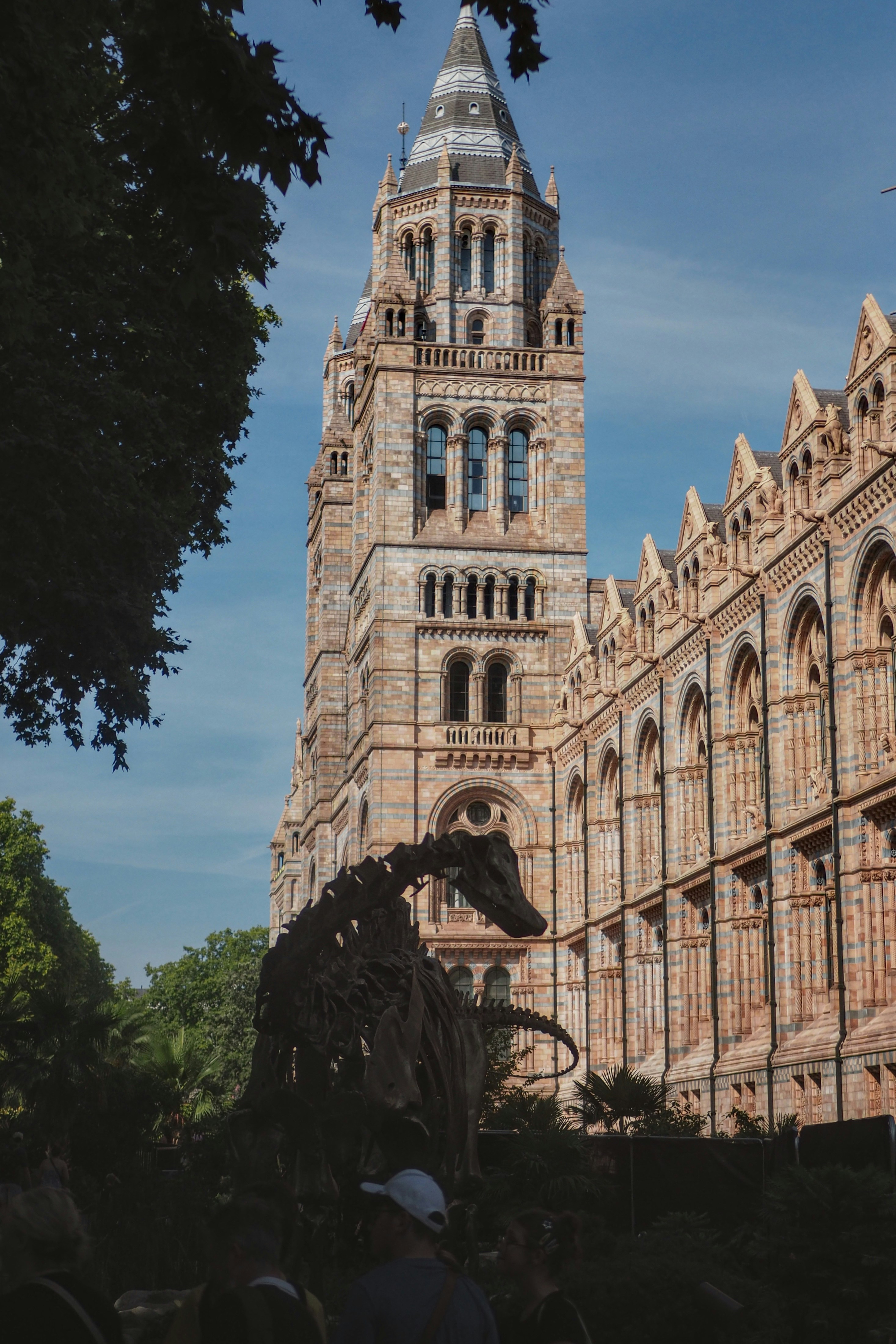 Gothic Facade and Dino silhouette beneath the Clocktower
